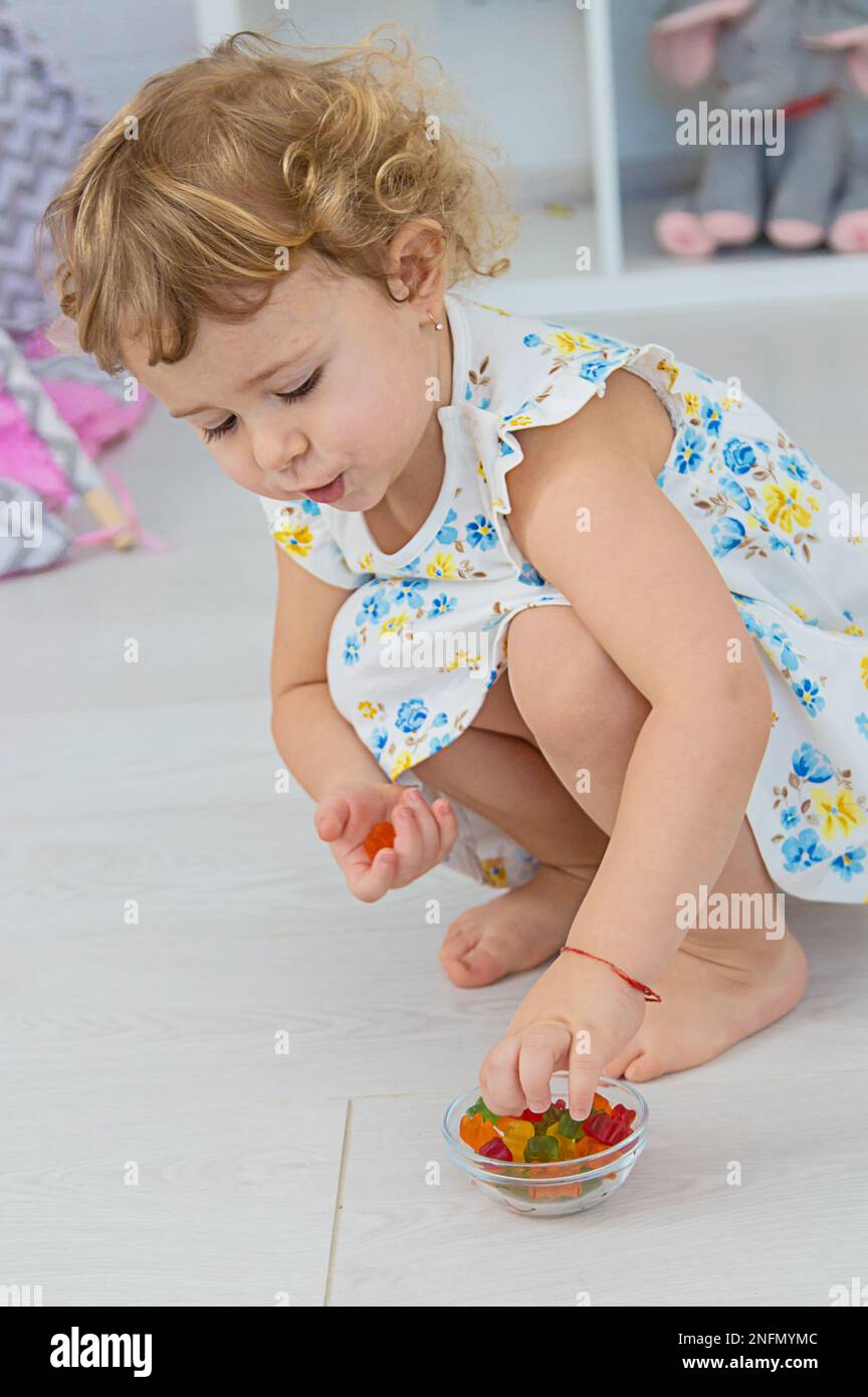 Child eats jelly candies hi-res stock photography and images - Alamy