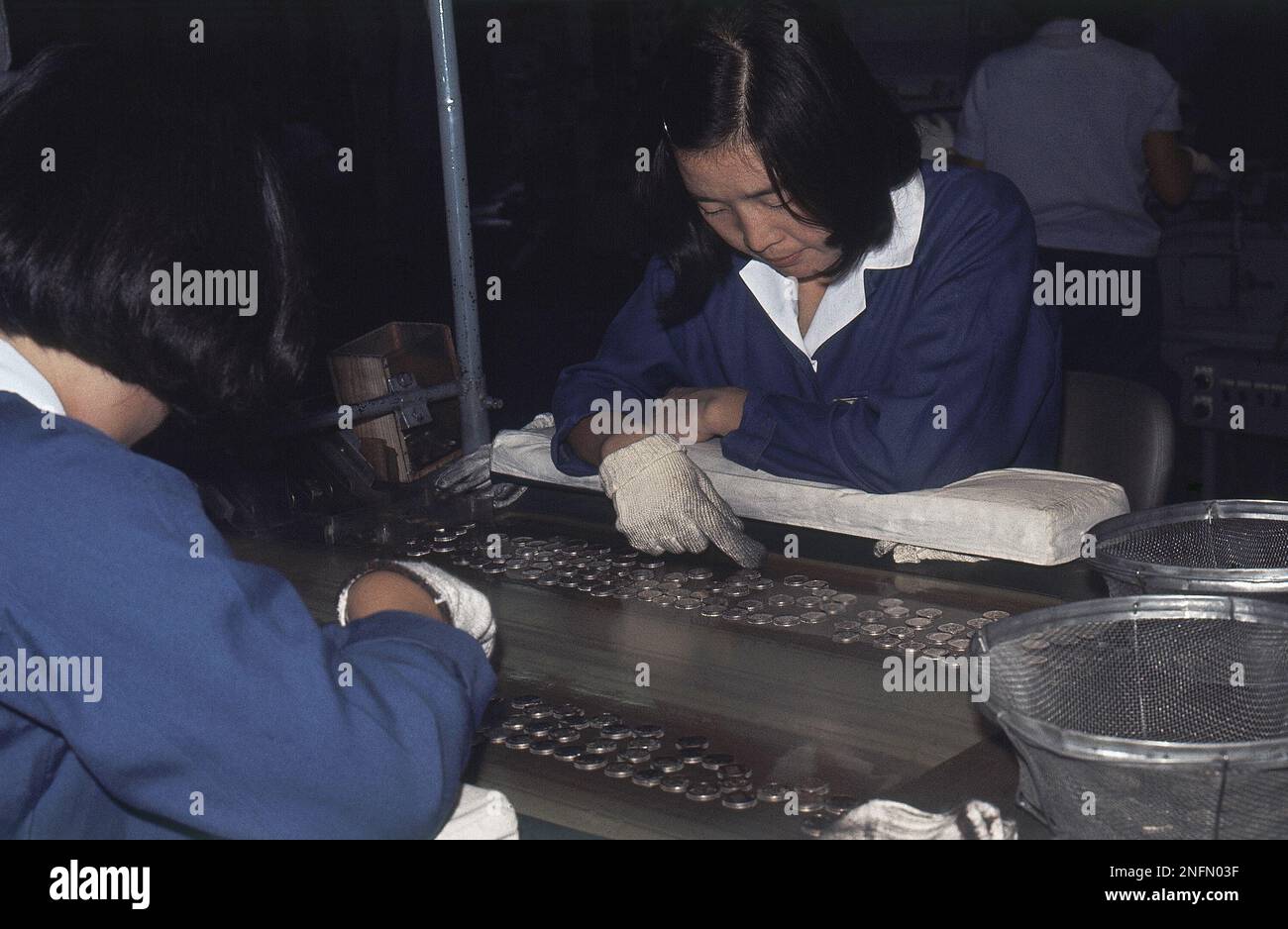 Workers at the Seikosha Watch Factory at Lake Suwa, Japan, are shown ...