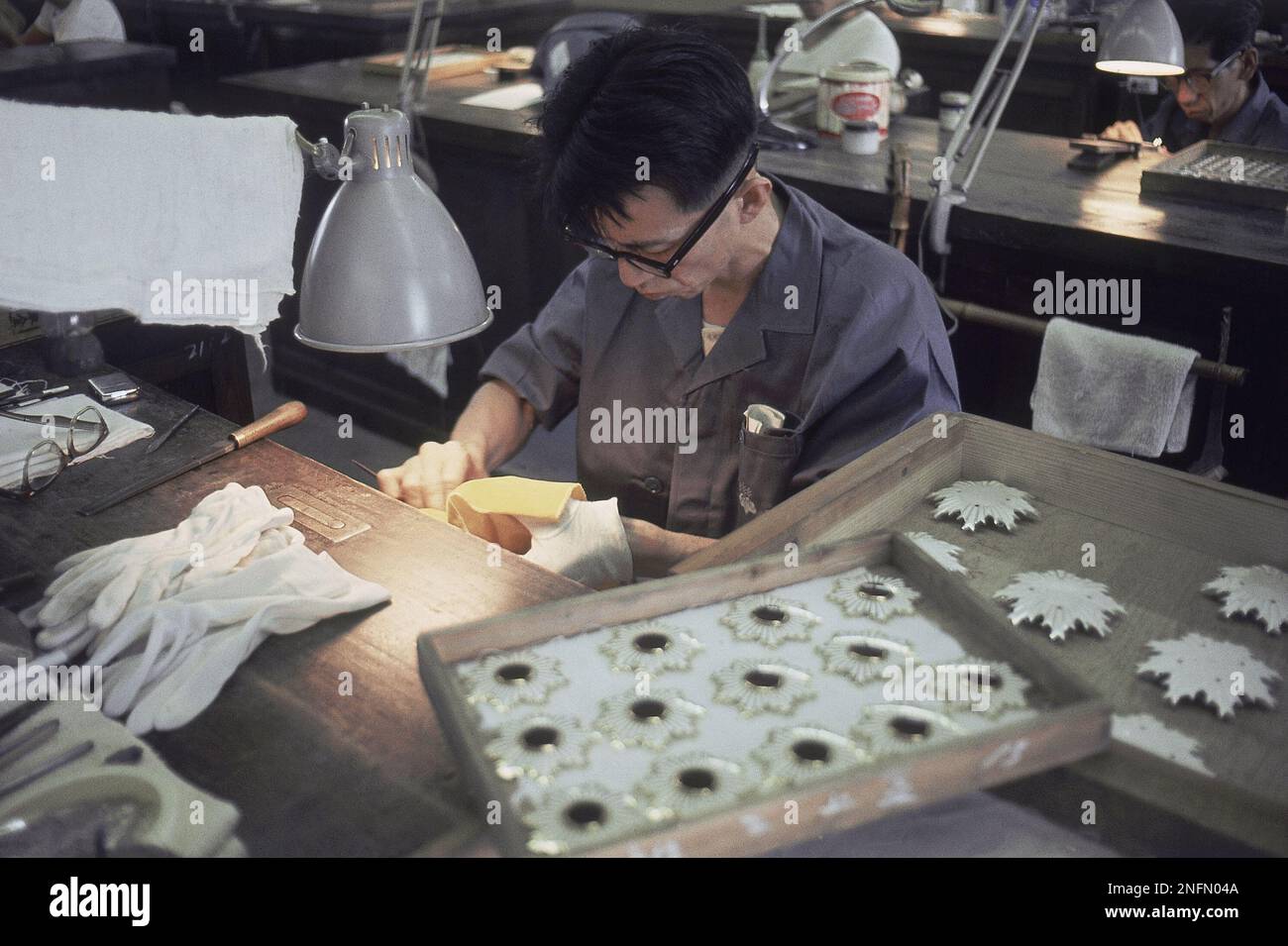 Workers at the Seikosha Watch Factory at Lake Suwa, Japan, are shown ...