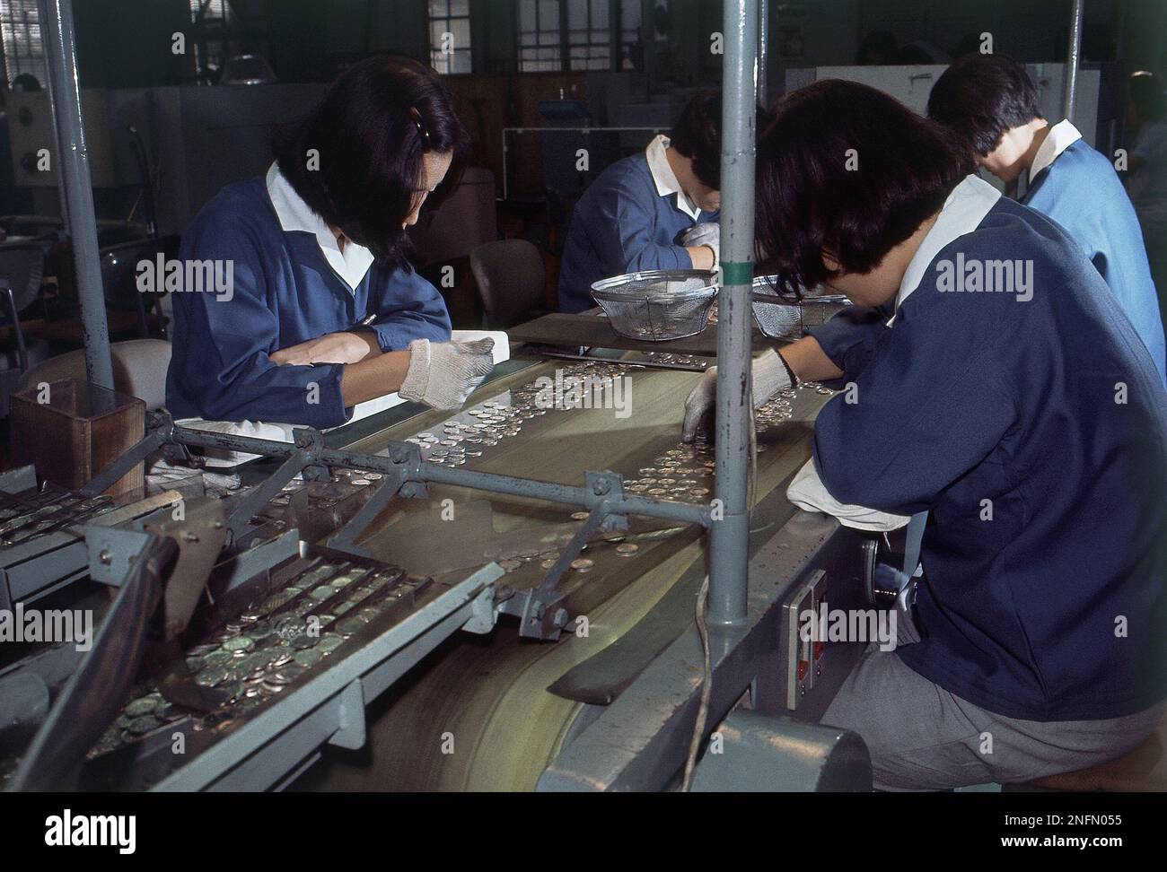Workers at the Seikosha Watch Factory at Lake Suwa, Japan, are shown ...