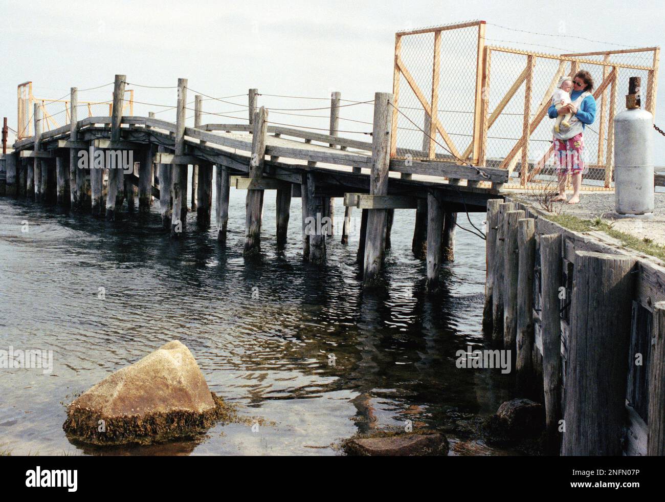 Allison Eyre holds her daughter at the Dike Bridge on Chappaquiddick ...