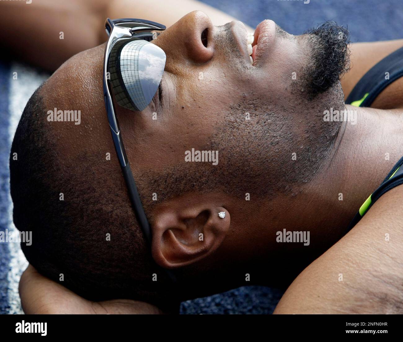 U.S. runner Angelo Taylor rests on the race track during the ISTAF ...