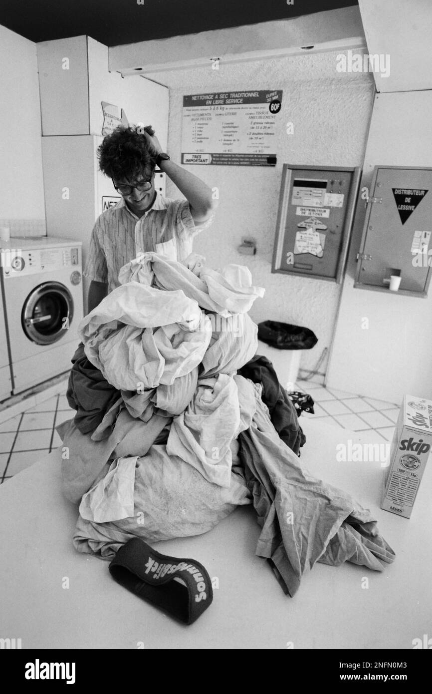 Archives 90ies: A young unmarrried man washes clothes in an automatic ...