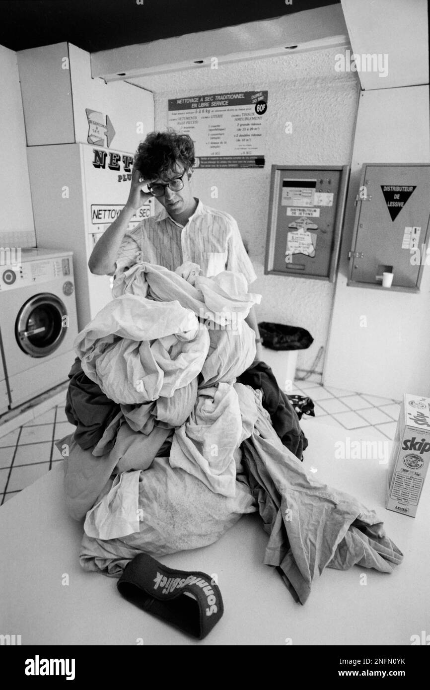 Archives 90ies: A young unmarrried man washes clothes in an automatic ...