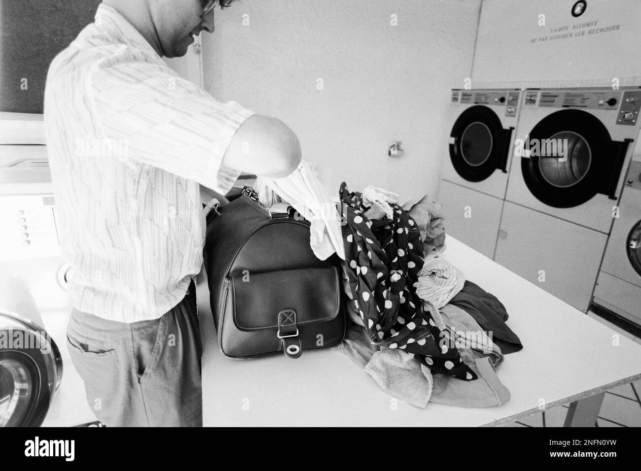 Archives 90ies: A young unmarrried man washes clothes in an automatic ...