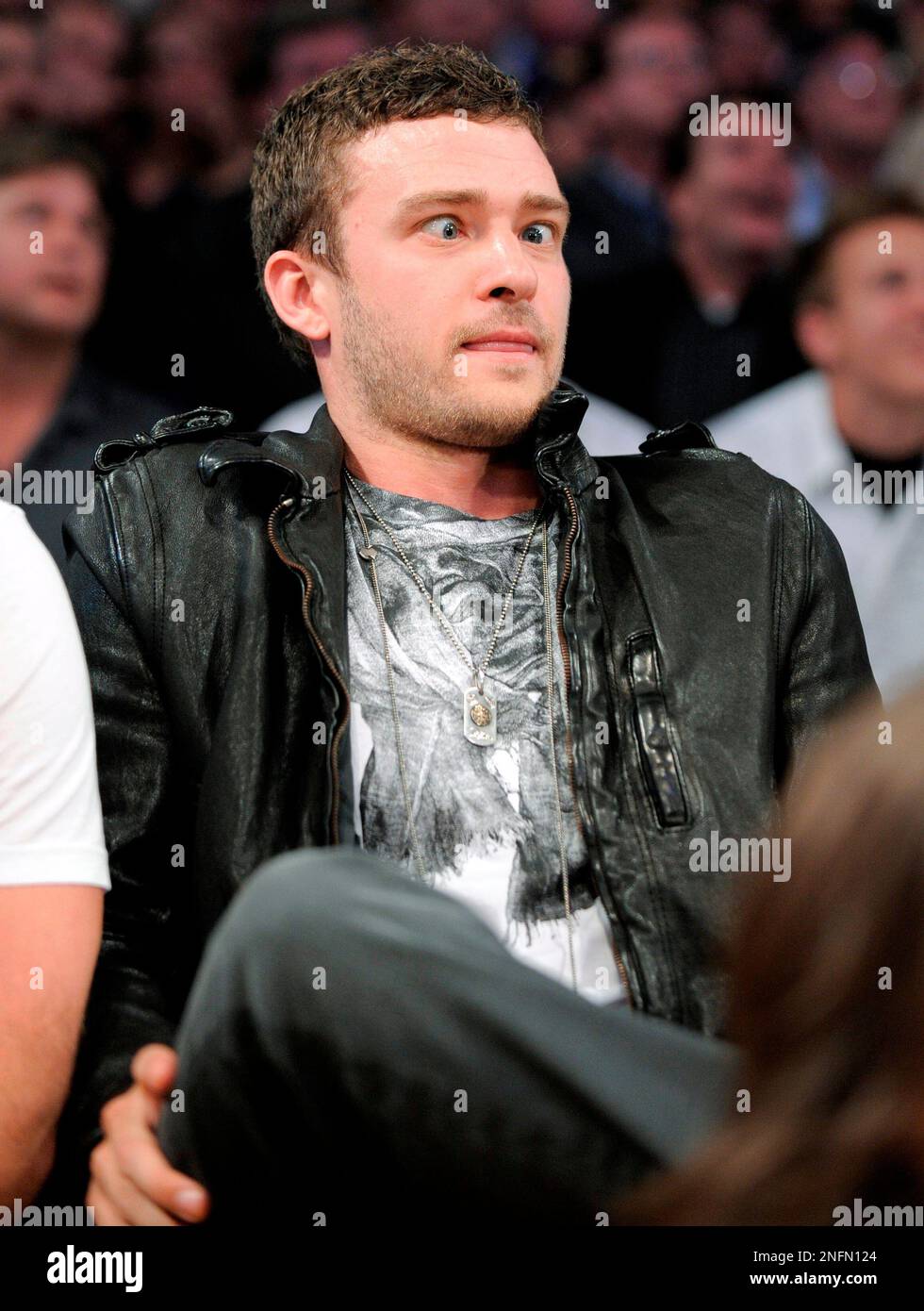 Justin Timberlake makes a funny face for the cameras as he watches Game ...