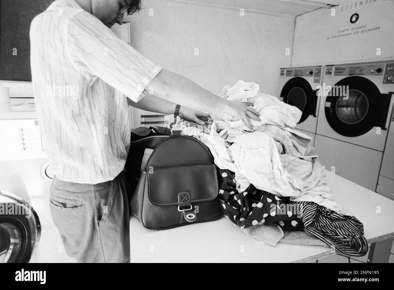 Archives 90ies: A young unmarrried man washes clothes in an automatic ...