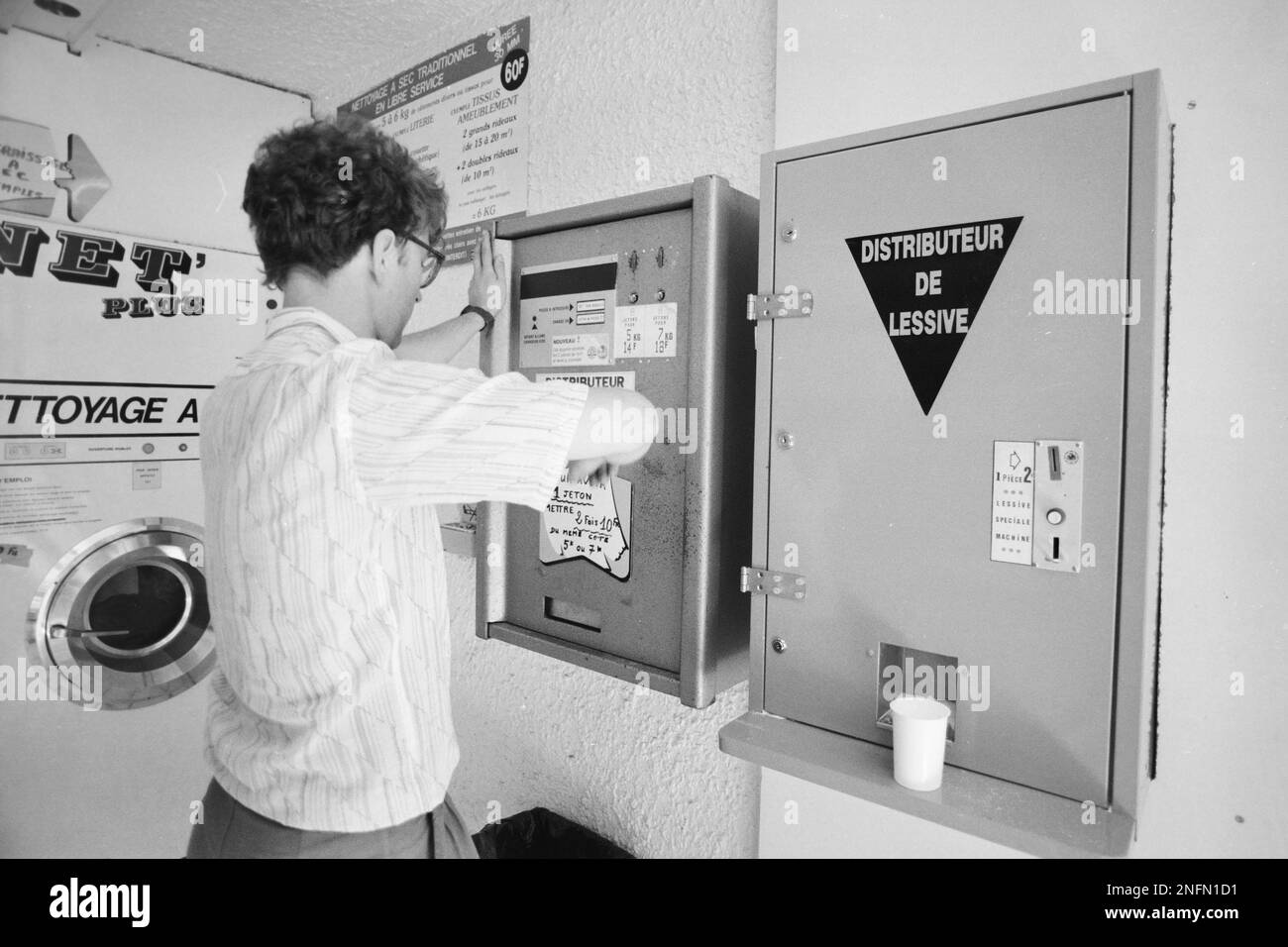 Archives 90ies: A young unmarrried man washes clothes in an automatic ...