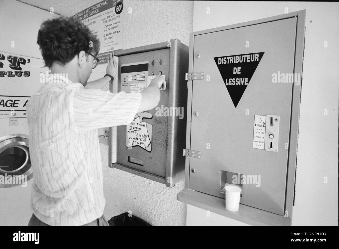 Archives 90ies: A young unmarrried man washes clothes in an automatic ...