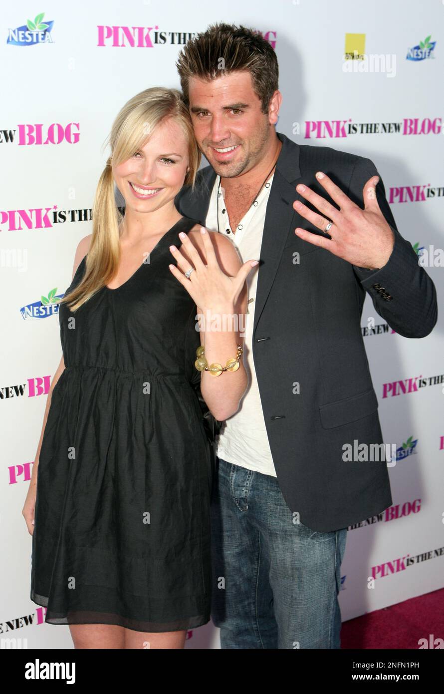 Jason Wahler (R) and Katja Decker Sadowski show of their rings when ...