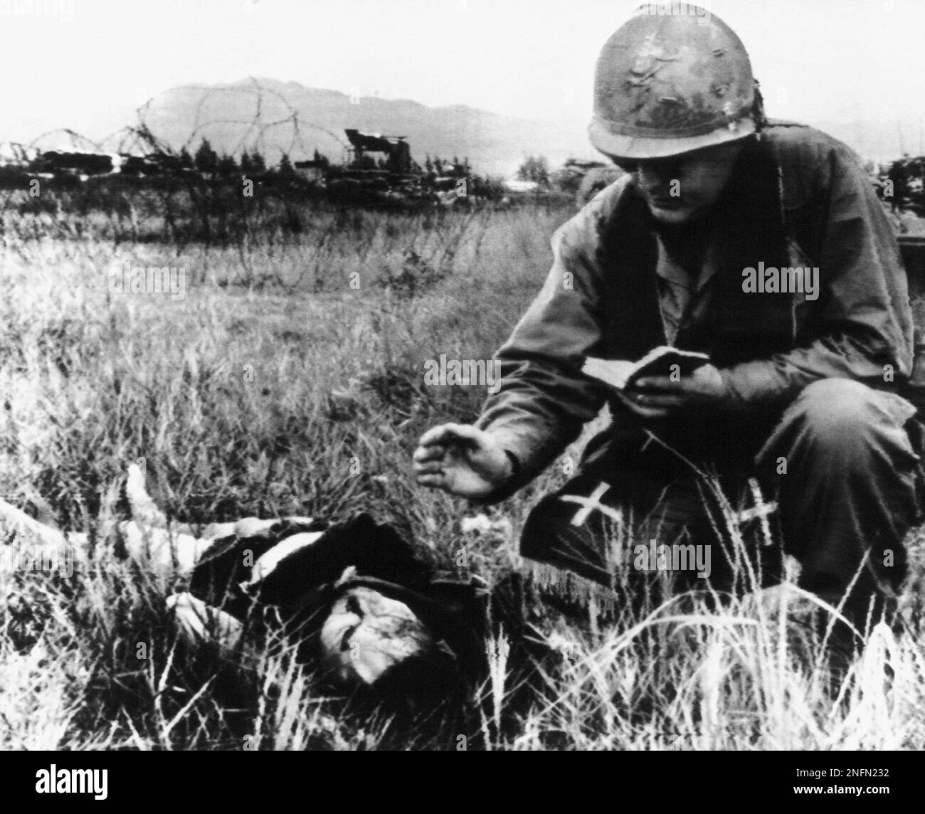 Captain Patrick Devine, Roman Catholic chaplain, says a prayer and ...