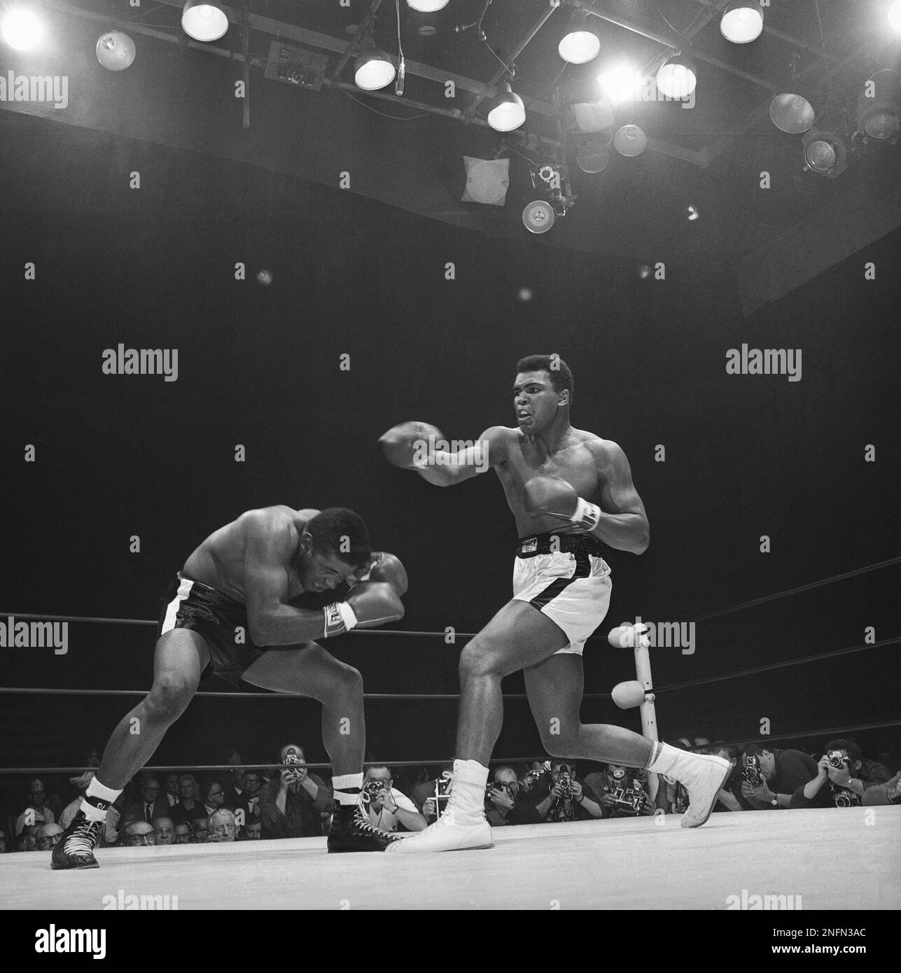 Challenger Floyd Patterson, left, avoids a right punch by champion ...