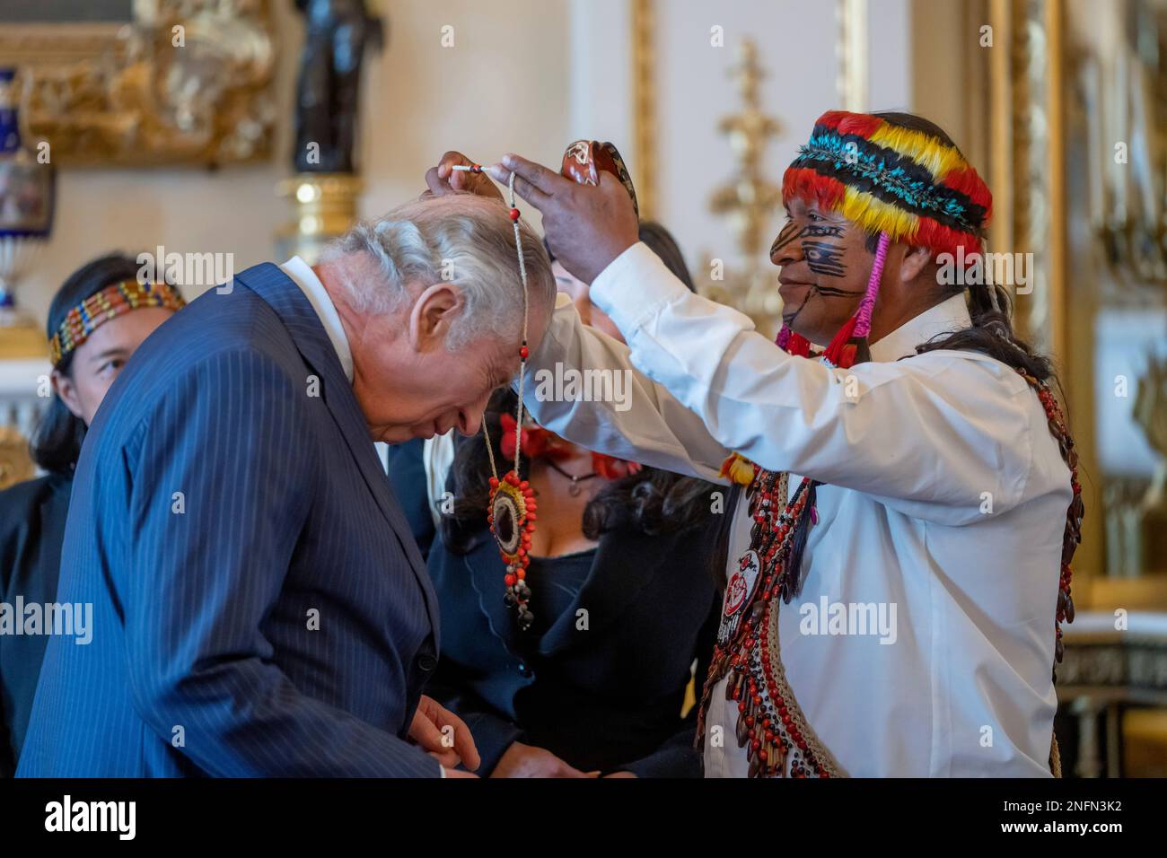 Amazon Indigenous leader Domingo Peas (right), presents a gift to King ...