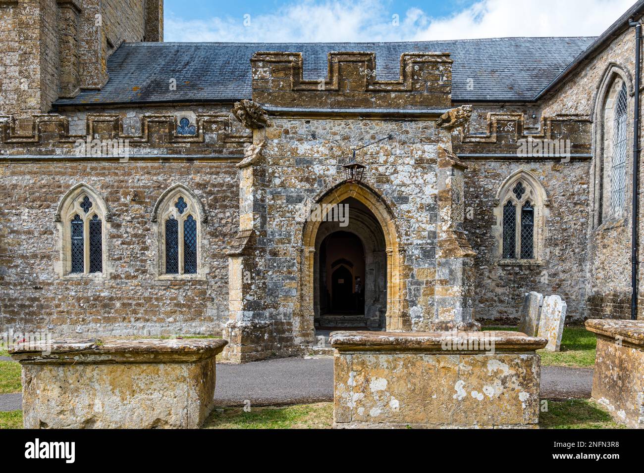 Entrance to St Candida and Holy Cross Church with old tombs, Whitchurch ...