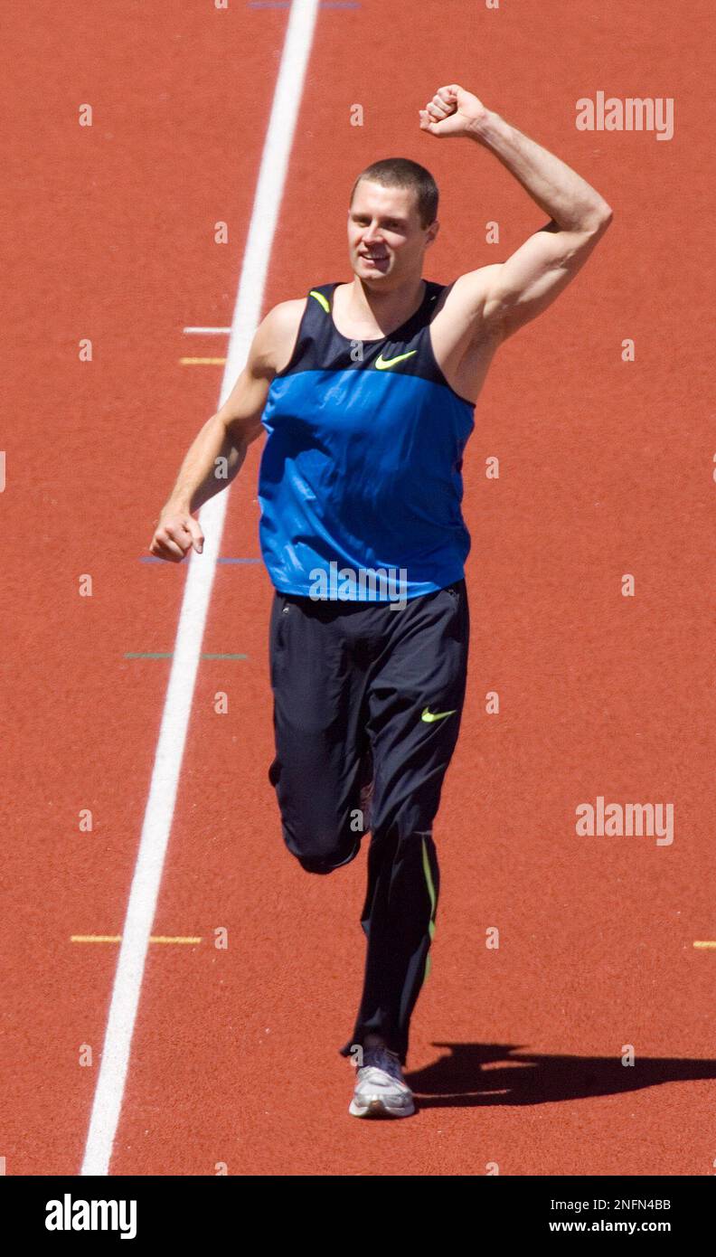 Pole vaulter Brad Walker takes his victory lap after clearing the bar ...