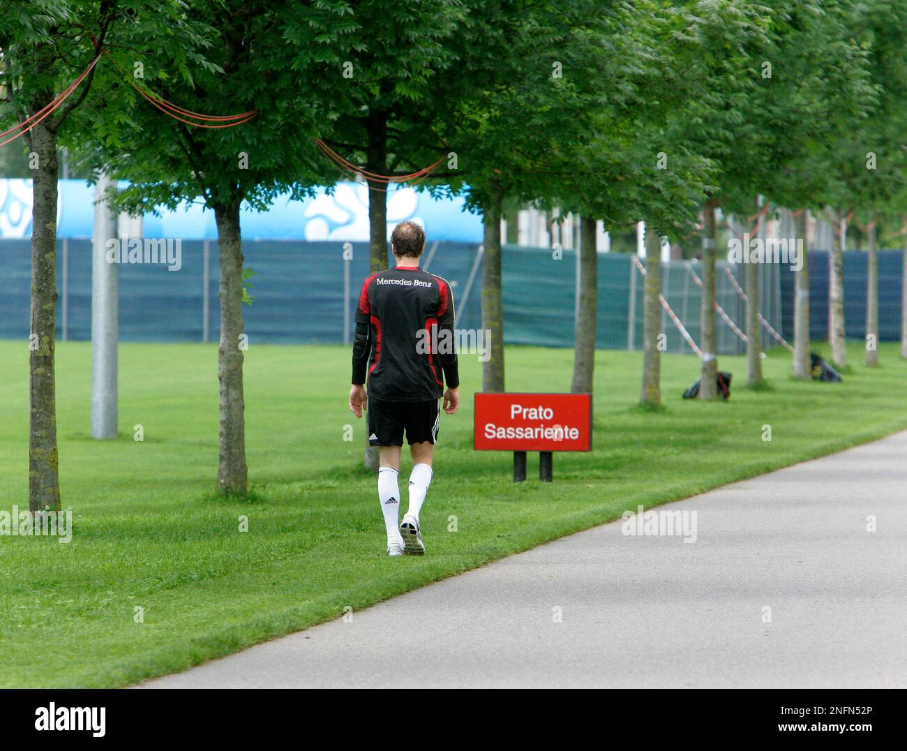 German goalkeeper Jens Lehmann strolls on a path next to the training ...