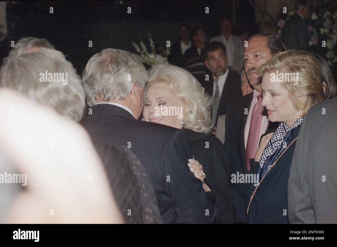 Zsa Zsa Gabor receives a tearful hug from friend Merv Griffin on ...