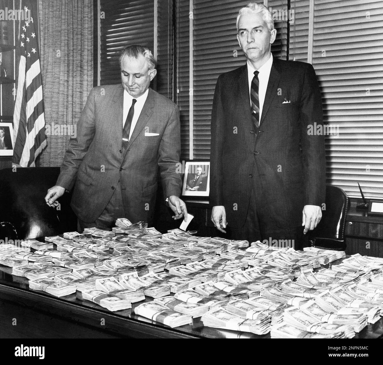 FBI Agents William Simon, left, and J.J. Casper, pose with some of the ...