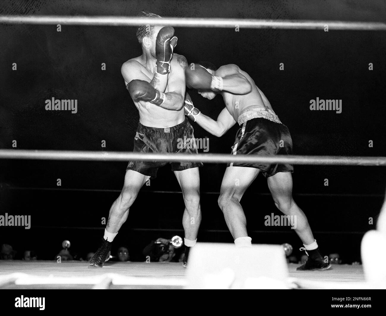 American boxers Joe Louis, right, and Jack Roper are seen in action ...