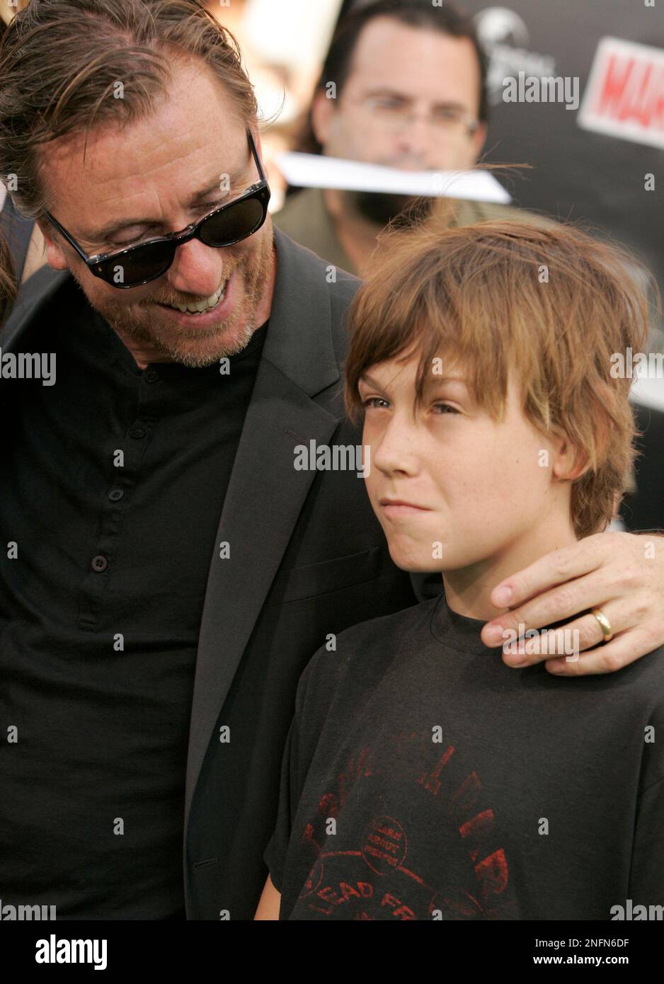 Actor Tim Roth, left hugs his son Tim Roth Jr. on the press line at the ...