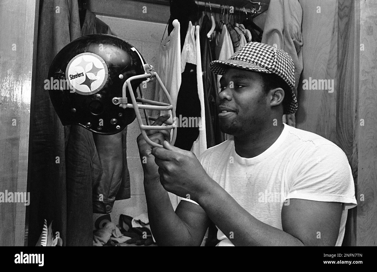 Pittsburgh Steelers defensive end Dwight White checks his helmet prior ...