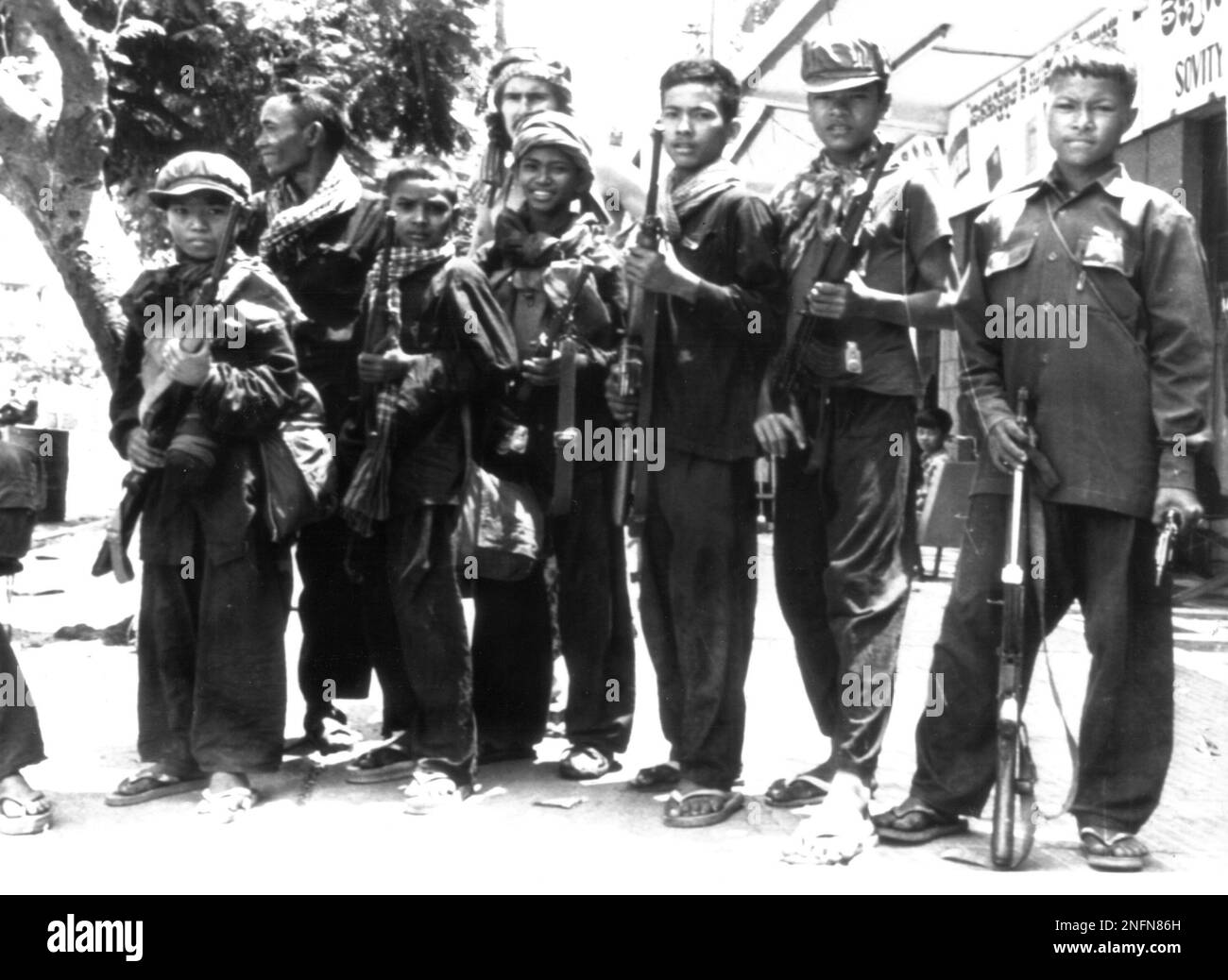 Posing for a portrait are these Khmer Rouge soldiers showing some of ...
