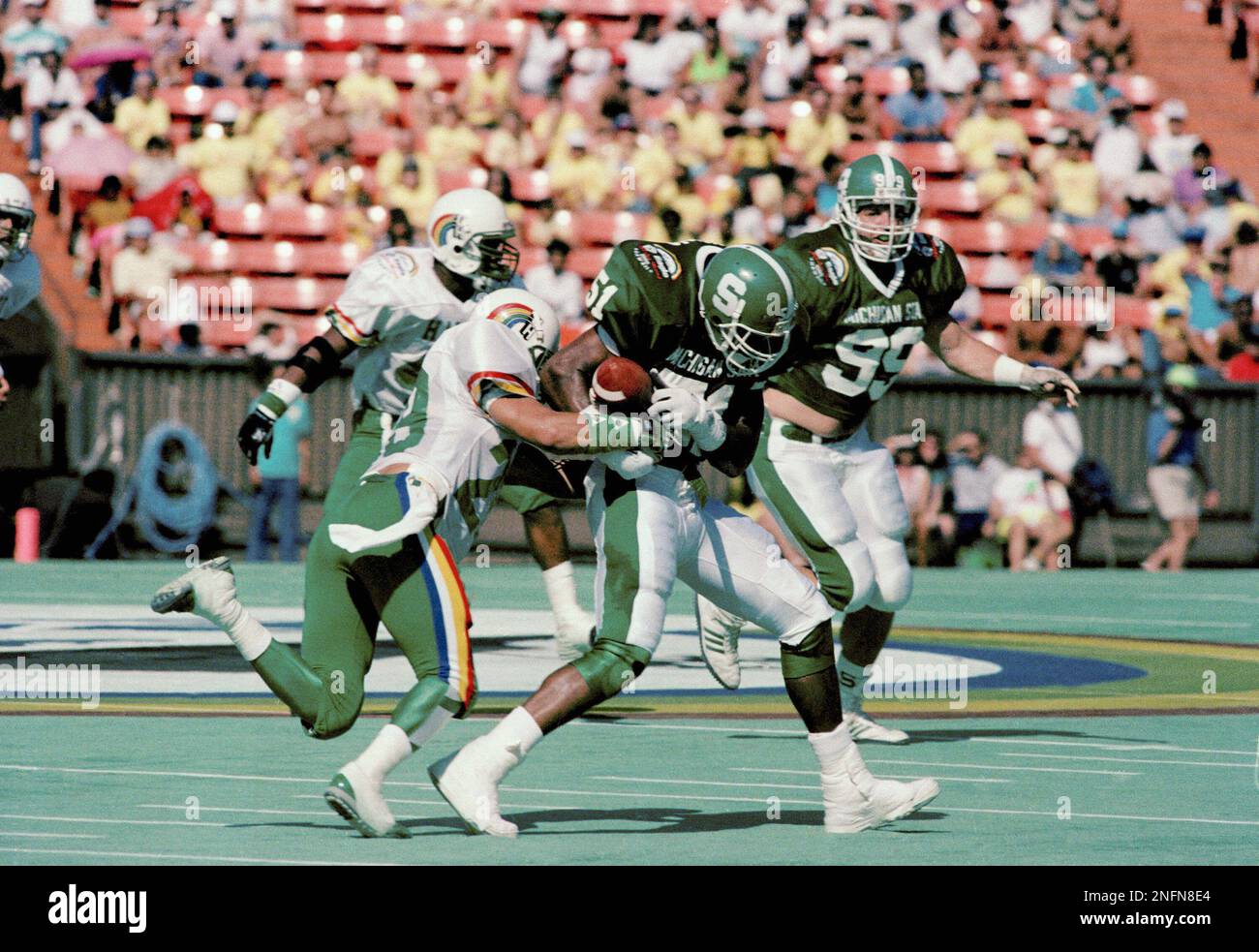 Michigan State's Carlos Jenkins (51) grabs an interception from Hawaii's Garrett Gabriel in the ...