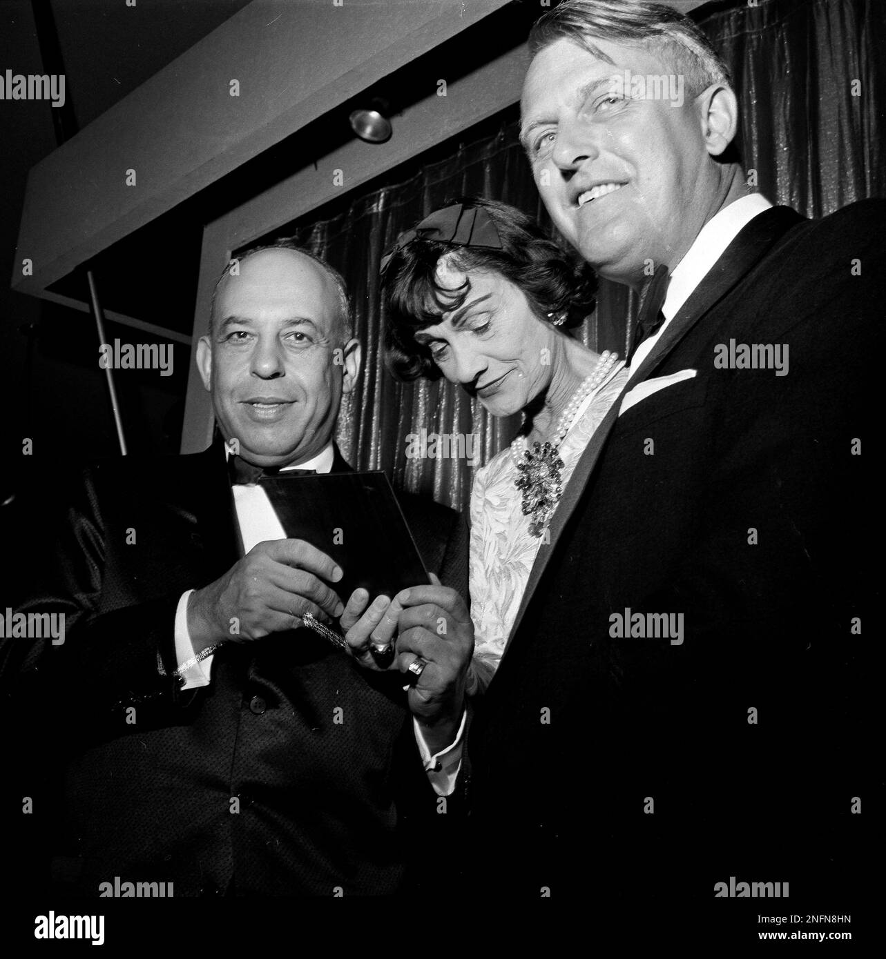 French fashion designer Coco Chanel poses with Stanley Marcus, left ...