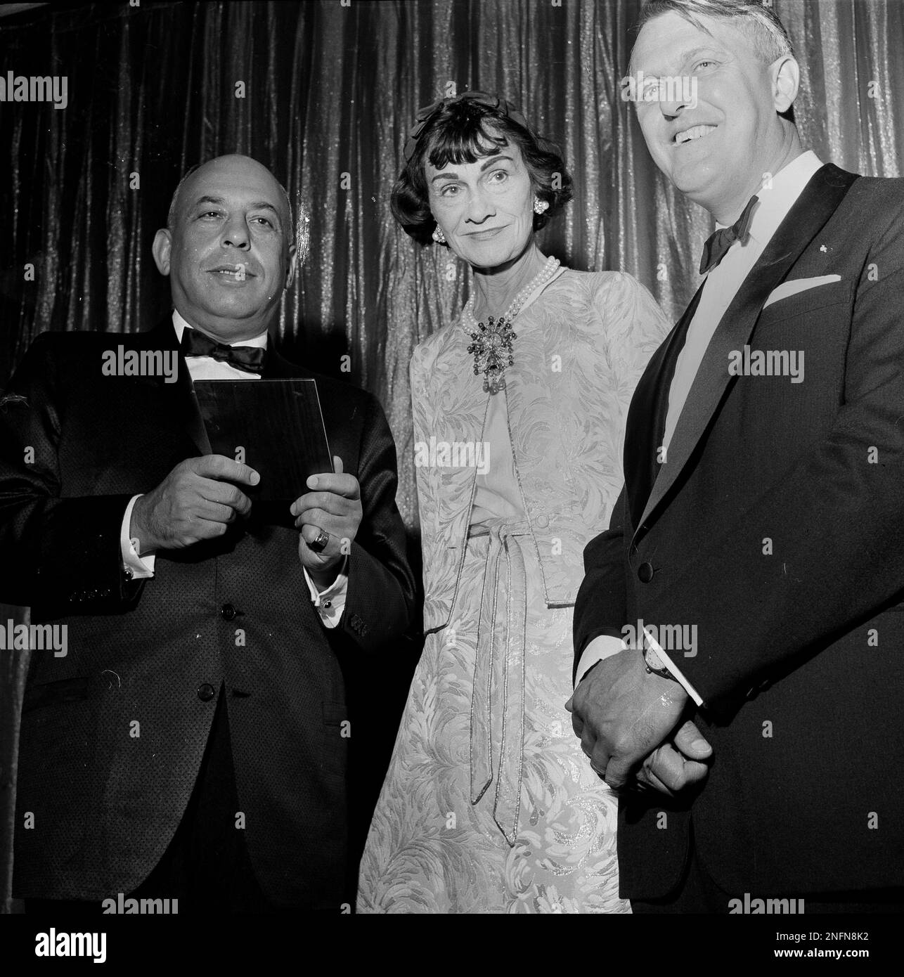 French fashion designer Coco Chanel poses with Stanley Marcus, left ...