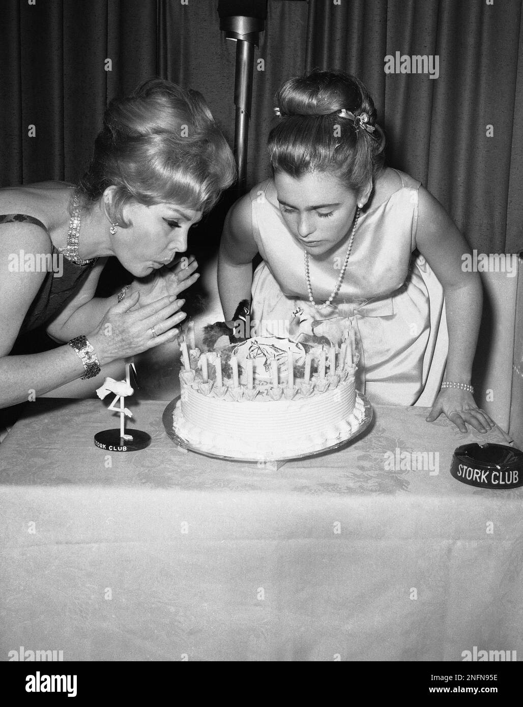 Zsa Zsa Gabor gives her daughter Francesca Hilton an assist as she ...