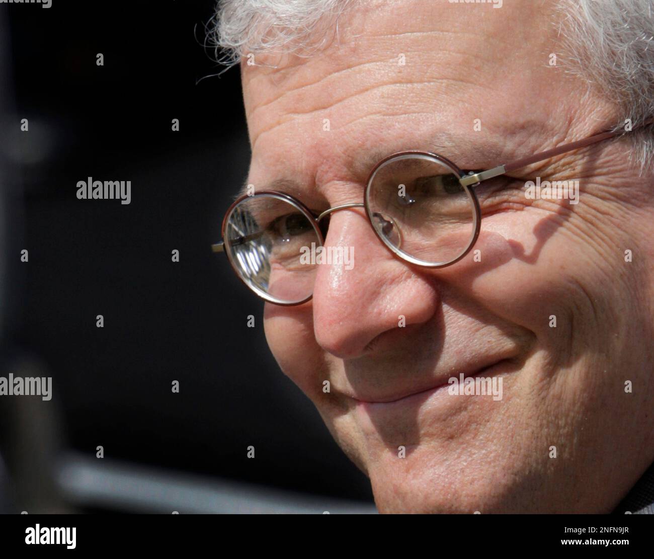 White House Chief of Staff Joshua Bolten smiles as he listens to ...