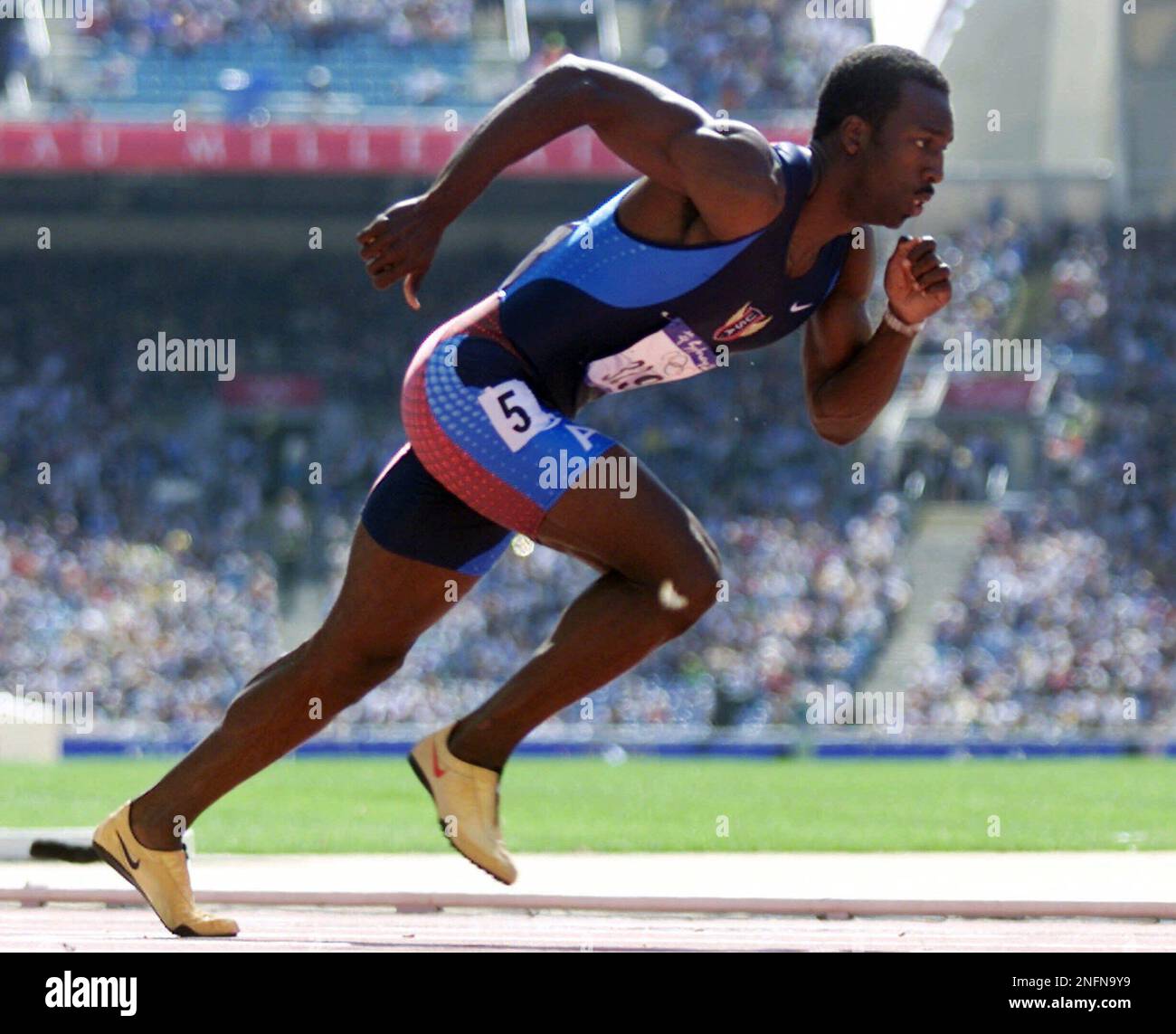 Michael Johnson, of the United States, competes in a 400m heat at the ...