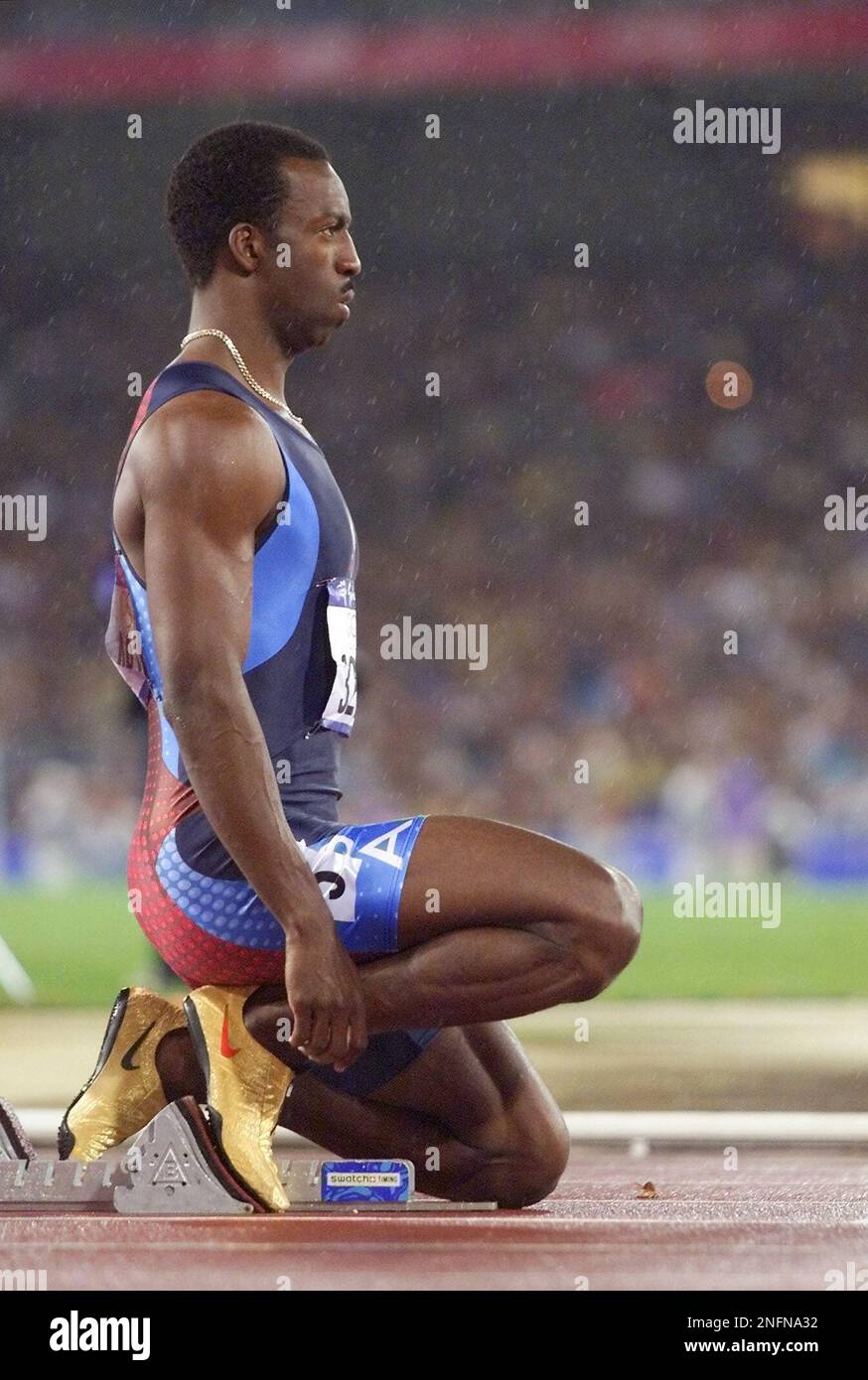 Michael Johnson of the United States, prepares to run in a semifinal ...