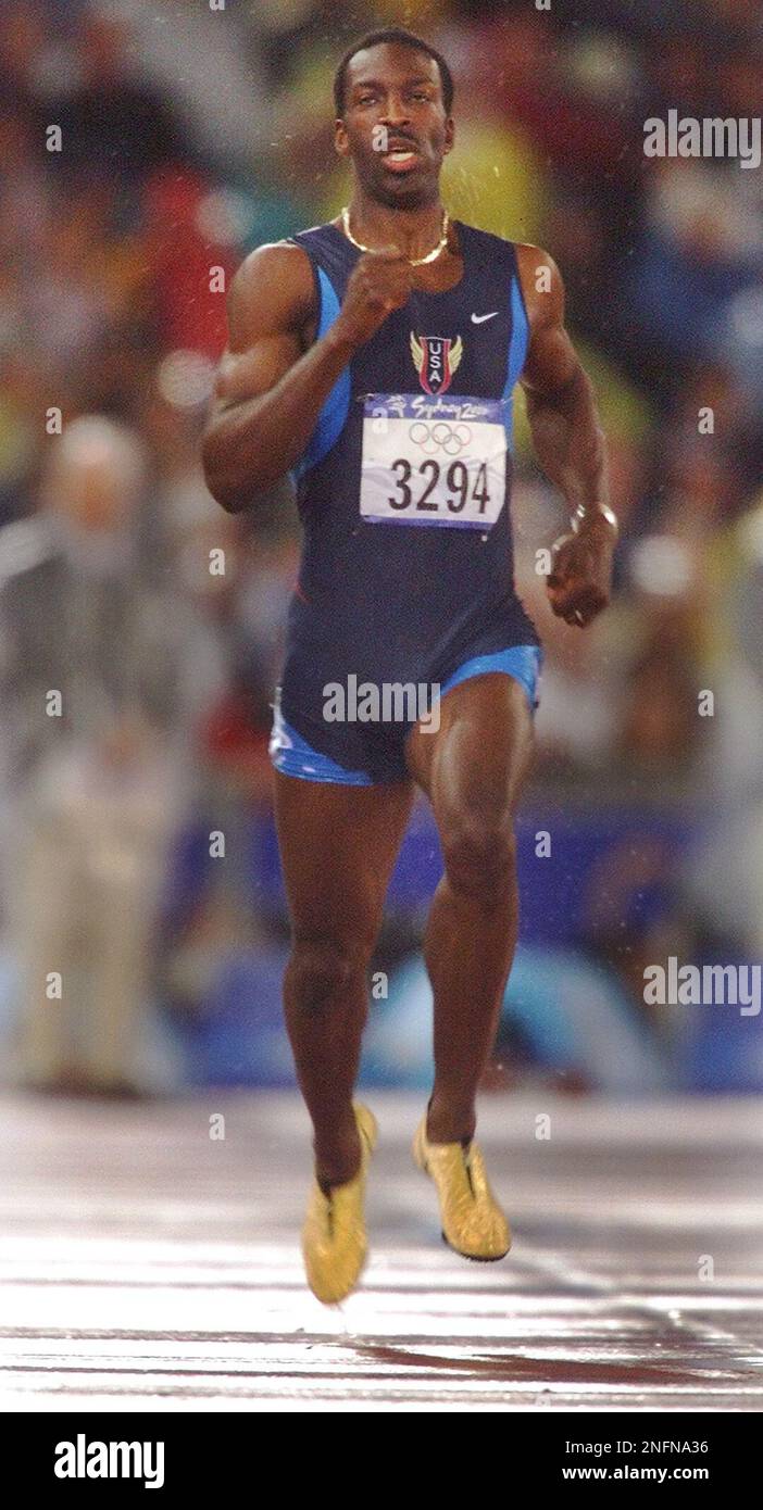 U.S. sprinter Michael Johnson competes in the first semifinal of the ...