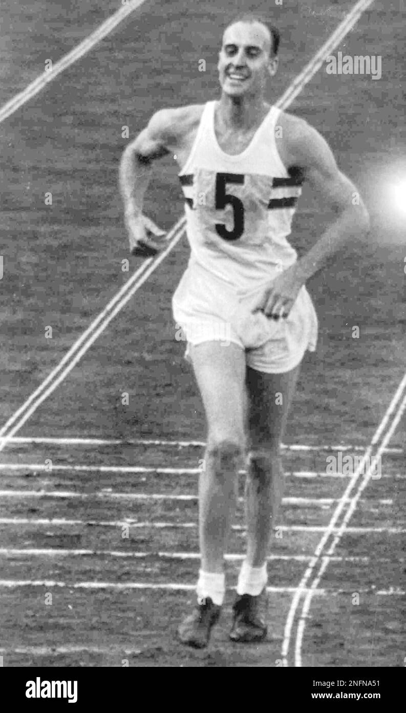 Britain's Ken Matthews, crosses the finishing line to win the Men's ...