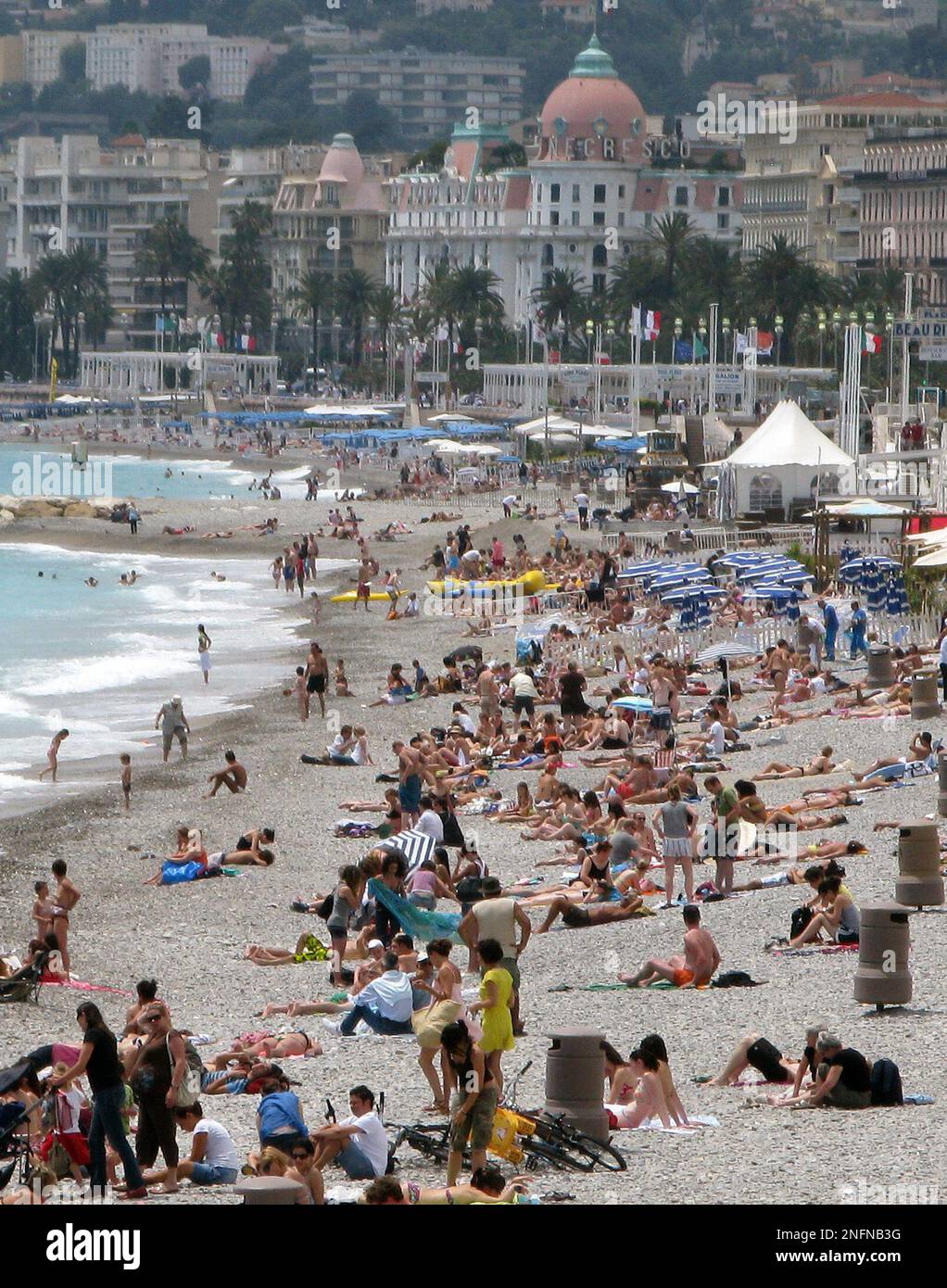 People sunbathe on the beach in Nice, southern France, Wednesday, June ...