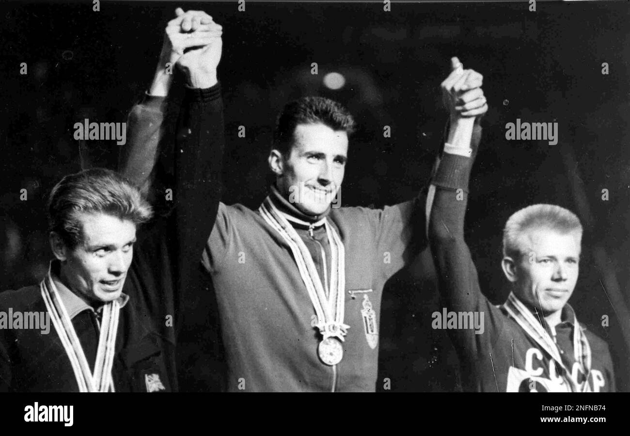 The winners of the Men's Olympic Games 3,000 metres steeplechase raise ...