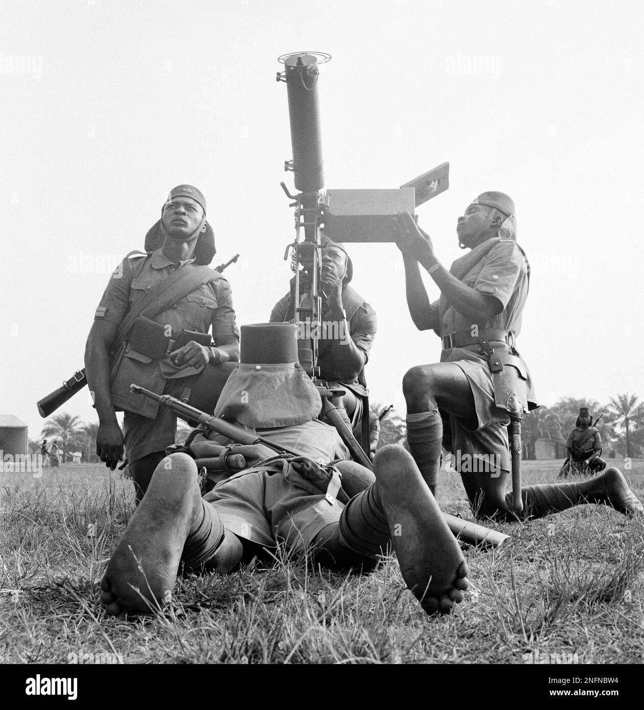 Native Troopers of the Belgian Congo man a machine gun set up for anti ...