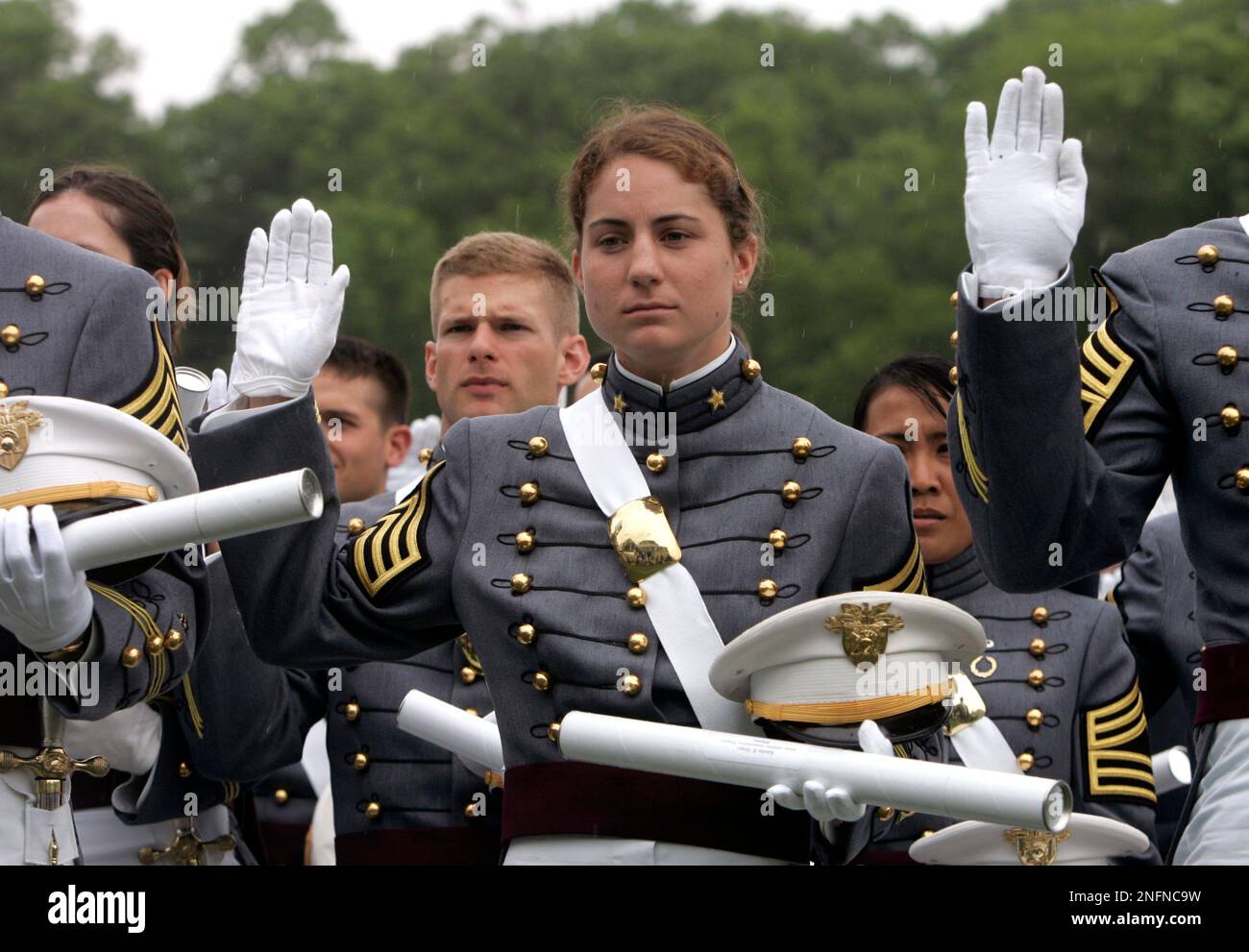 Cadets are sworn in during a graduation and commissioning ceremonies at ...