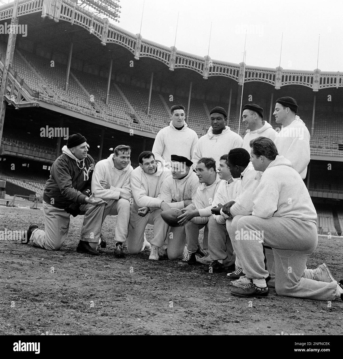 Head Coach Jim Lee Howell, left, poses with his probable offensive team ...