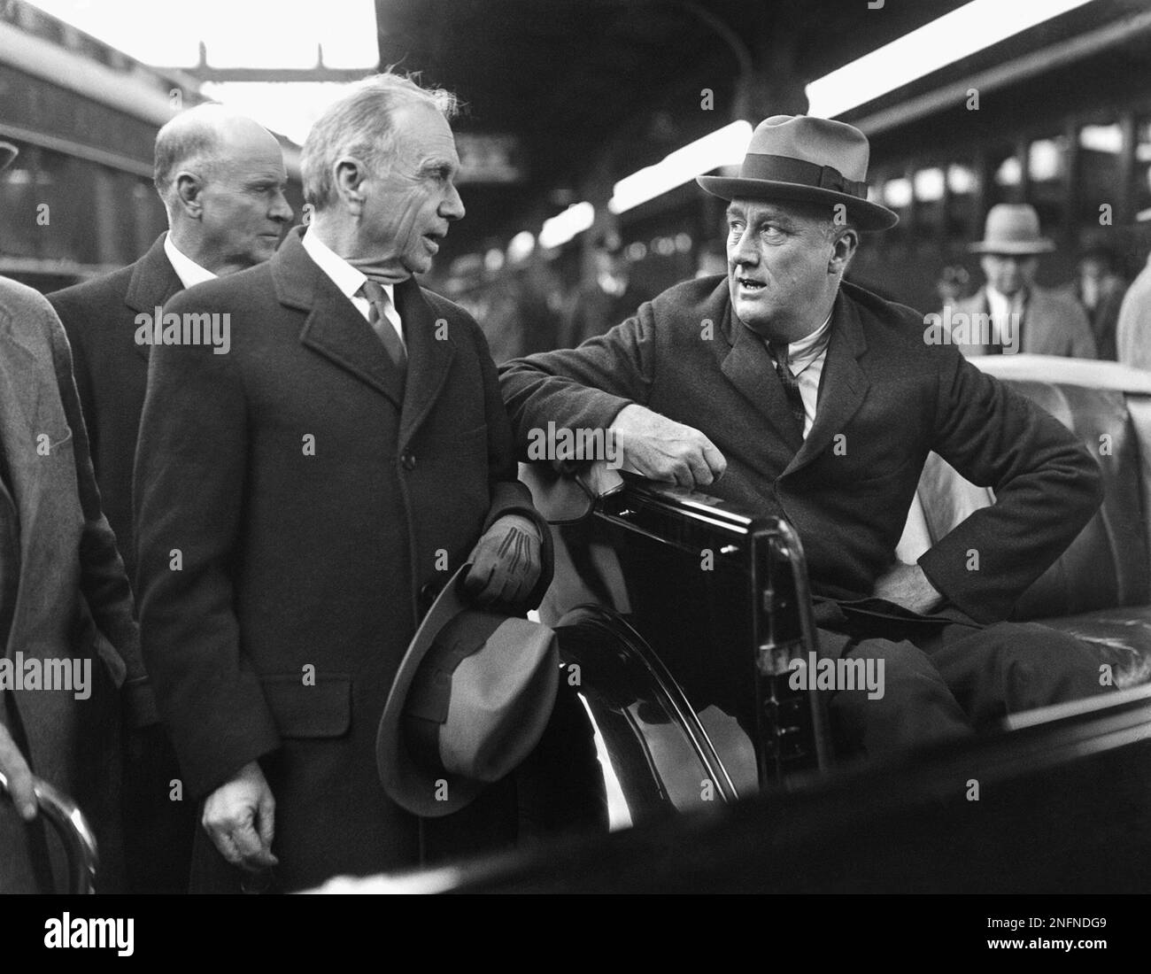President Franklin D. Roosevelt is shown speaking with Secretary of ...