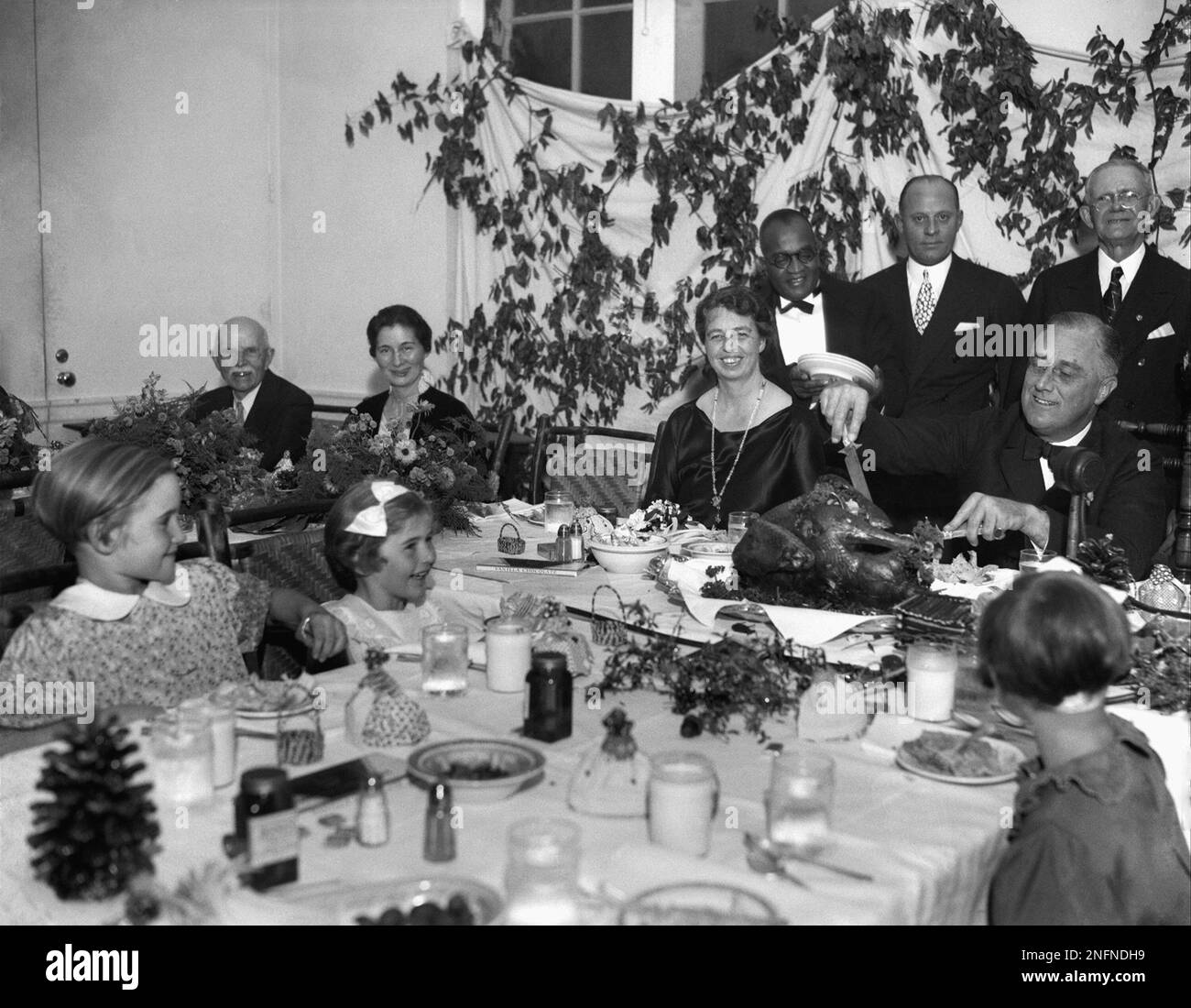 President Franklin D. Roosevelt carves the turkey during the annual ...