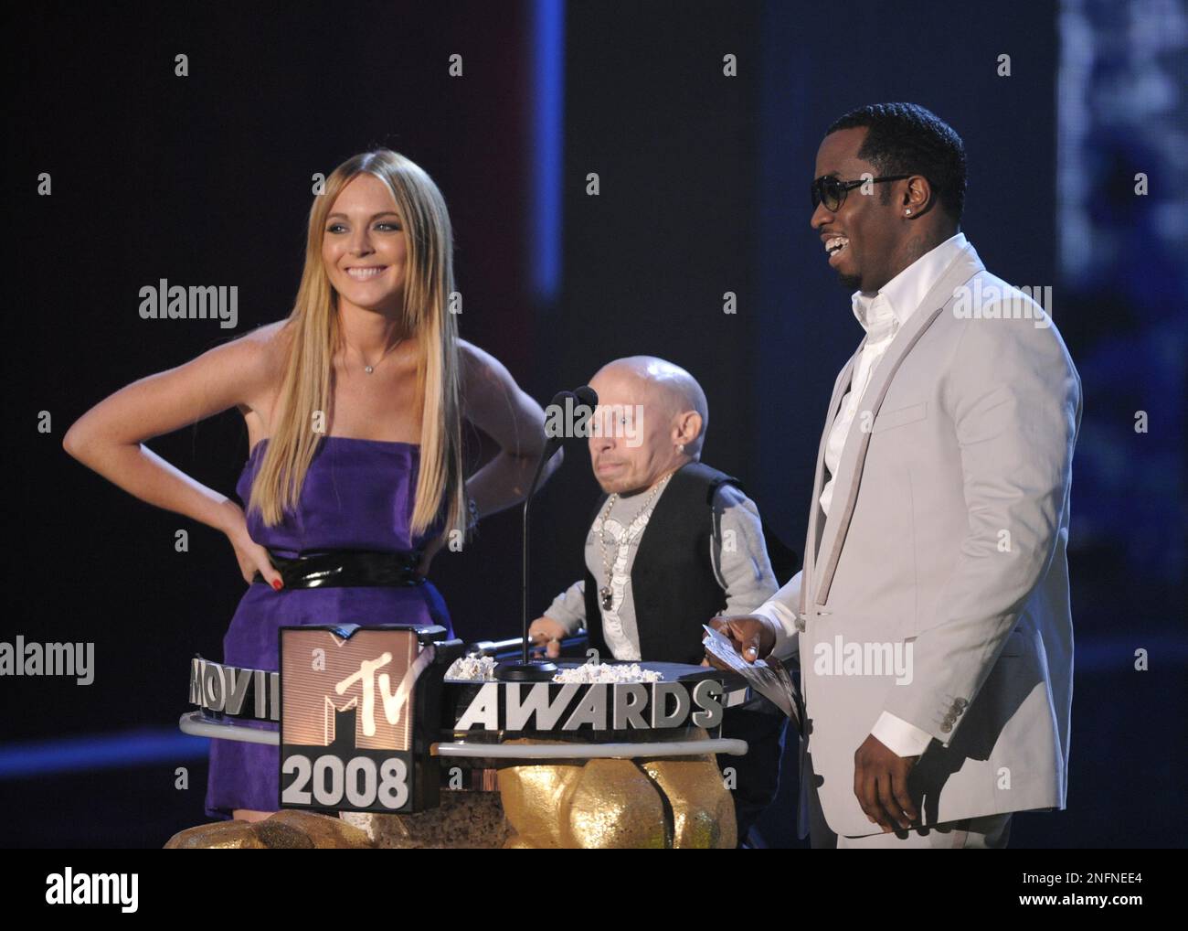 Lindsay Lohan, left, Verne Troyer, center, and Sean "Diddy" Combs are ...