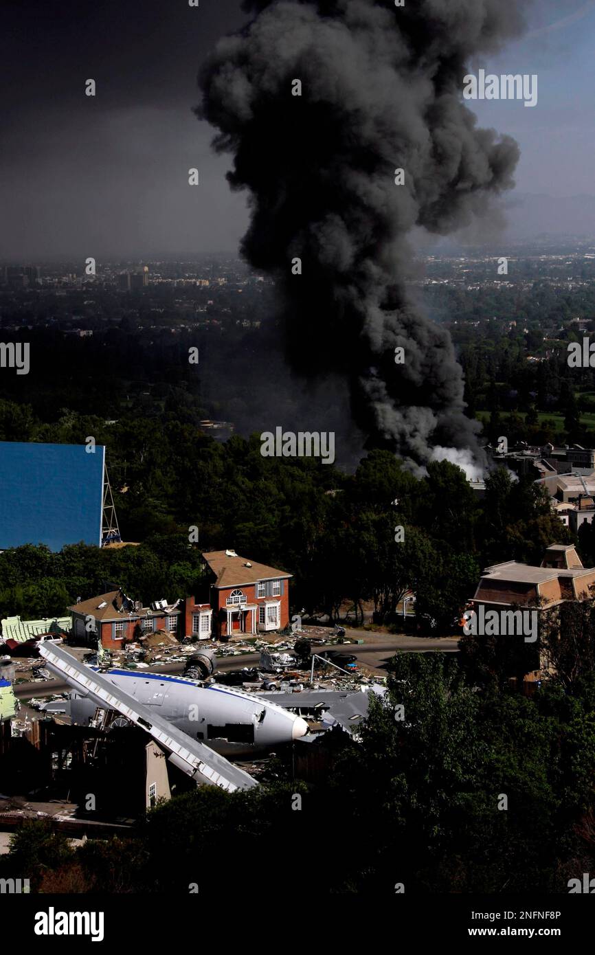 Plumes of smoke are seen at Universal Studios in Los Angeles Sunday ...