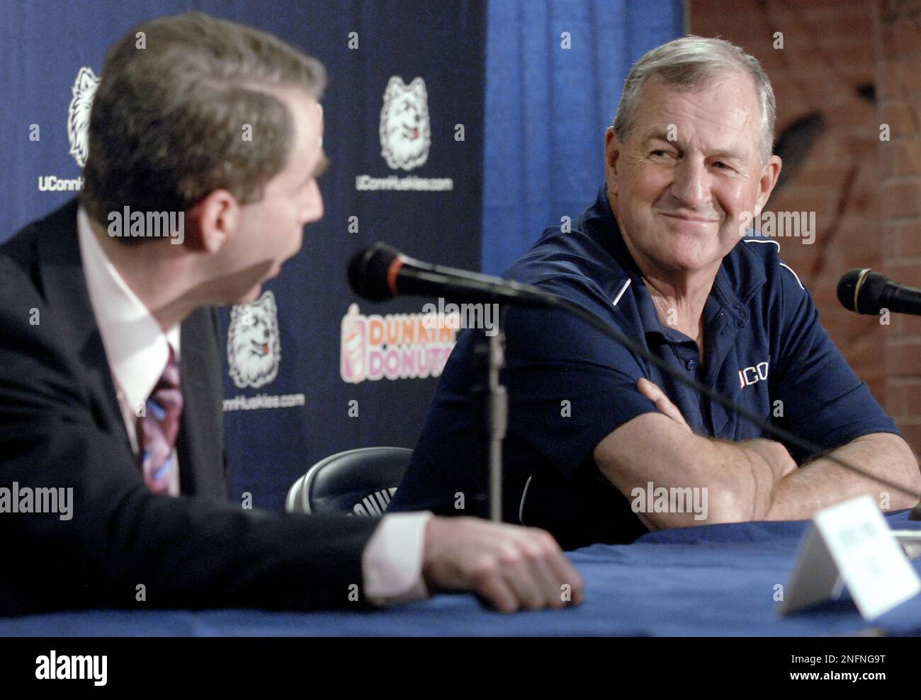 Connecticut head coach Jim Calhoun, right, listens to his physician, Dr ...