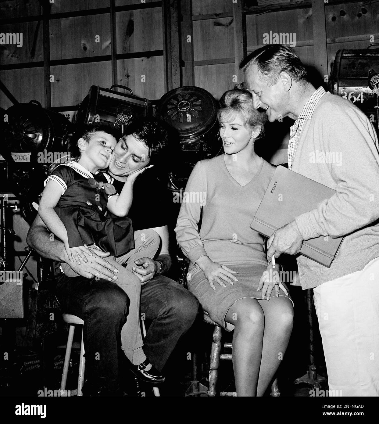 Actor Alain Delon gets hug from little Tammy Locke, who plays his ...