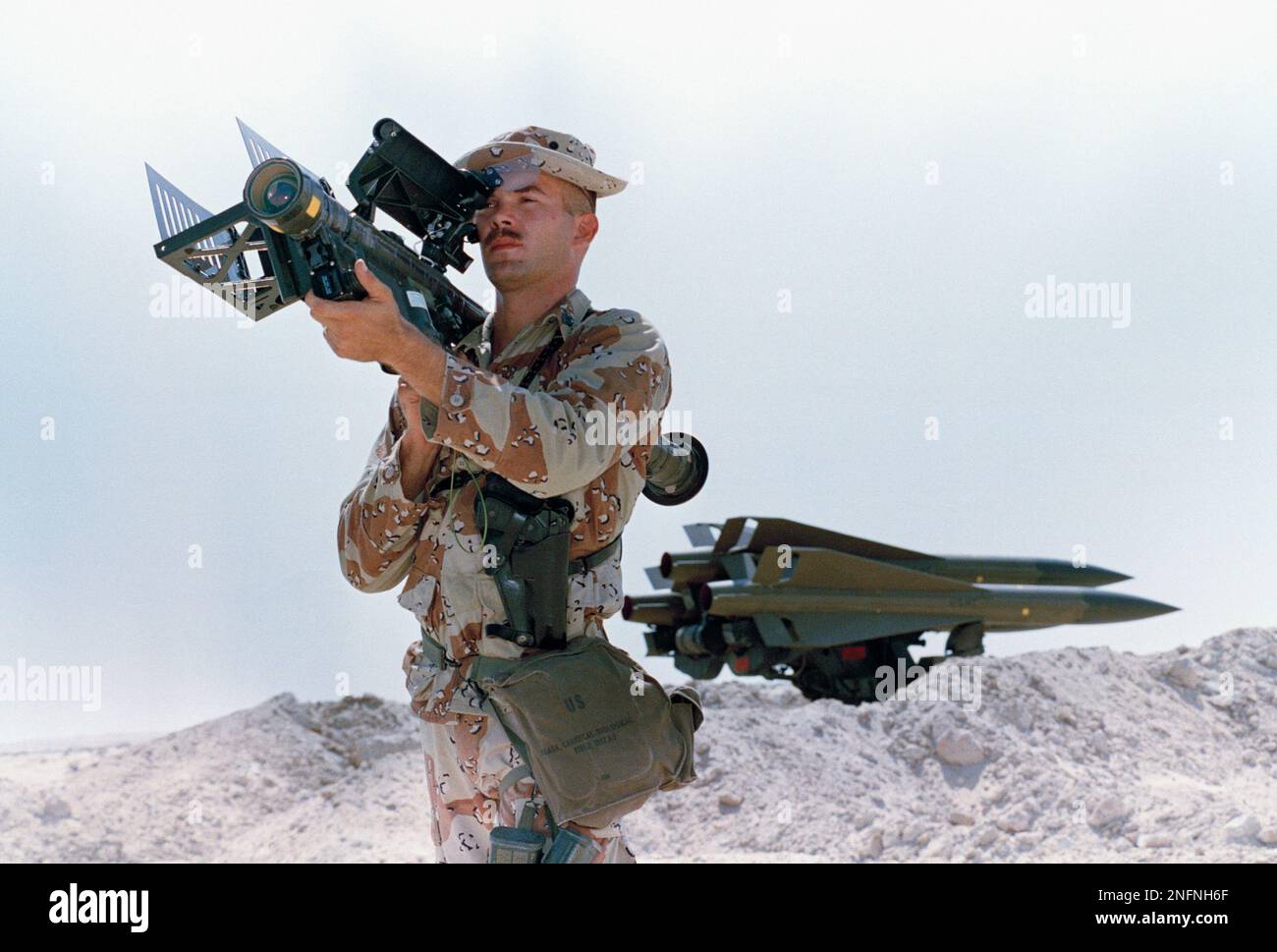 U.S. Marine holds stinger anti-aircraft missile, on Oct. 3, 1990, in ...
