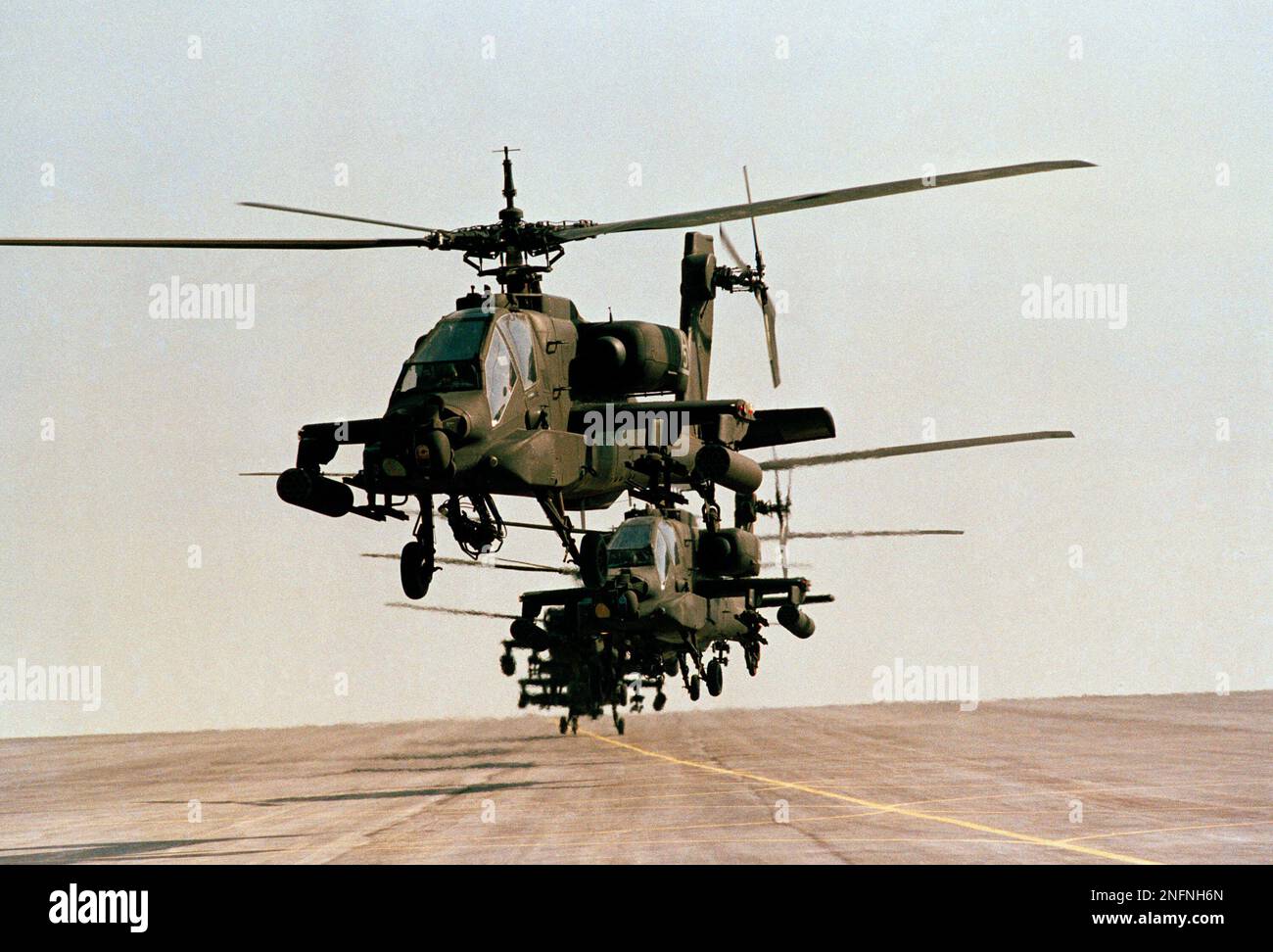 U.S. Air Force Apache Helicopters take off from the Persian Gulf, as ...