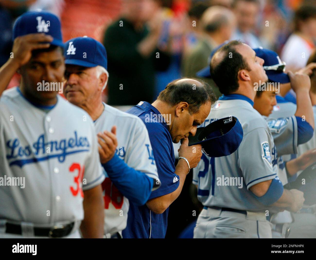 Los Angeles Dodgers manager Joe Torre, center, reacts before donning ...