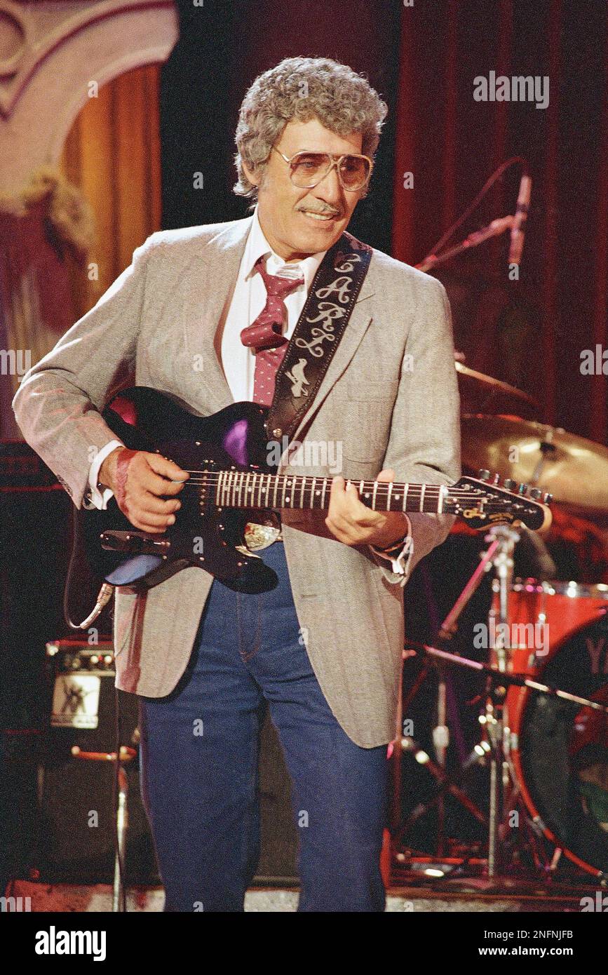 Rockabilly singer Carl Perkins is shown performing in on New Years Eve ...